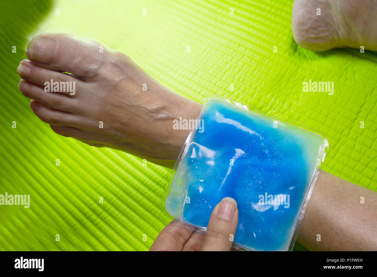 Woman ice pack leg hi-res stock photography and images - Alamy