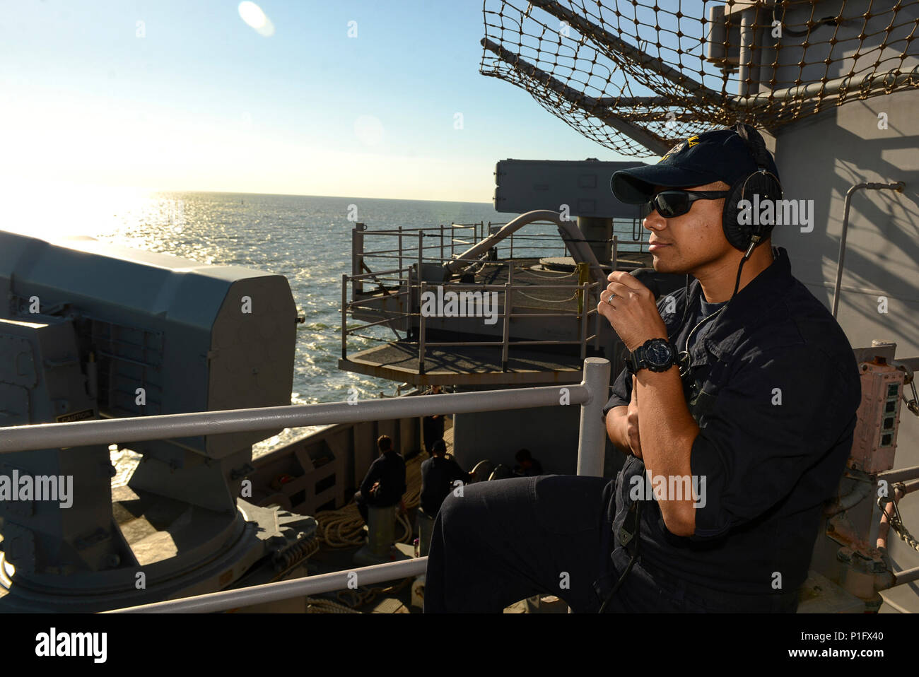 NORFOLK (Oct. 24, 2016) – Seaman Jose Rolon uses a sound powered phone ...
