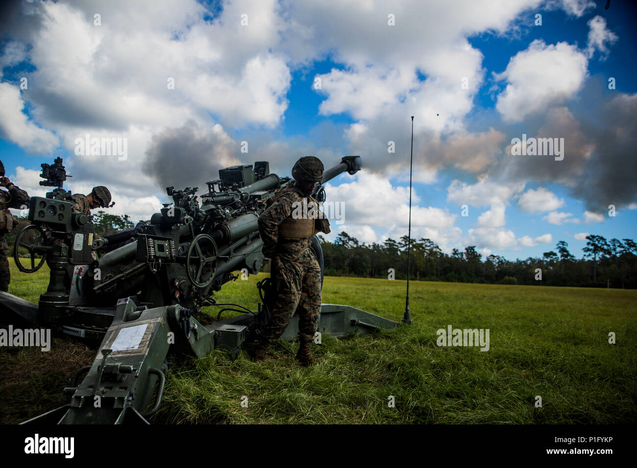 U.S. Marines fire a M777 lightweight Howitzer during a Tactical Air ...