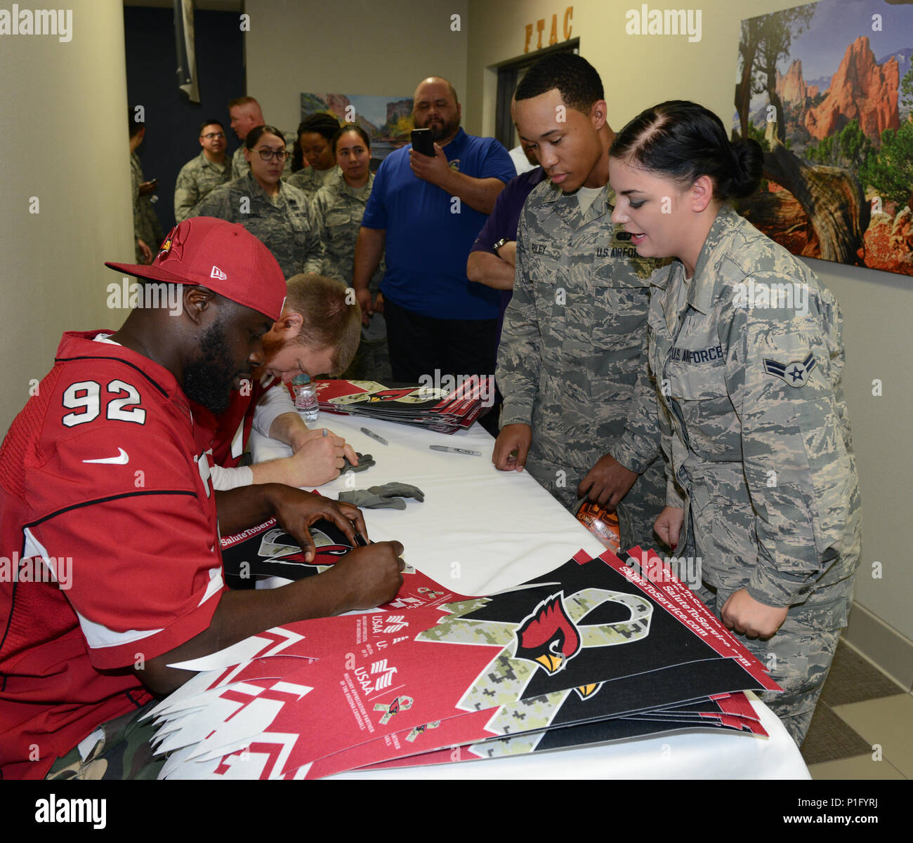 Airmen receive autographed banner from Frostee Rucker, Arizona ...