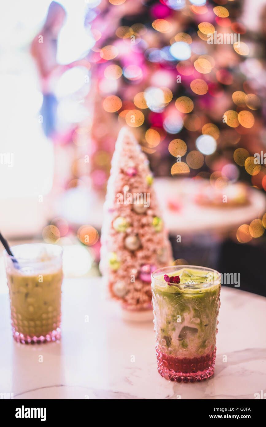 matcha drinks on a table with colorful christmas decor Stock Photo - Alamy