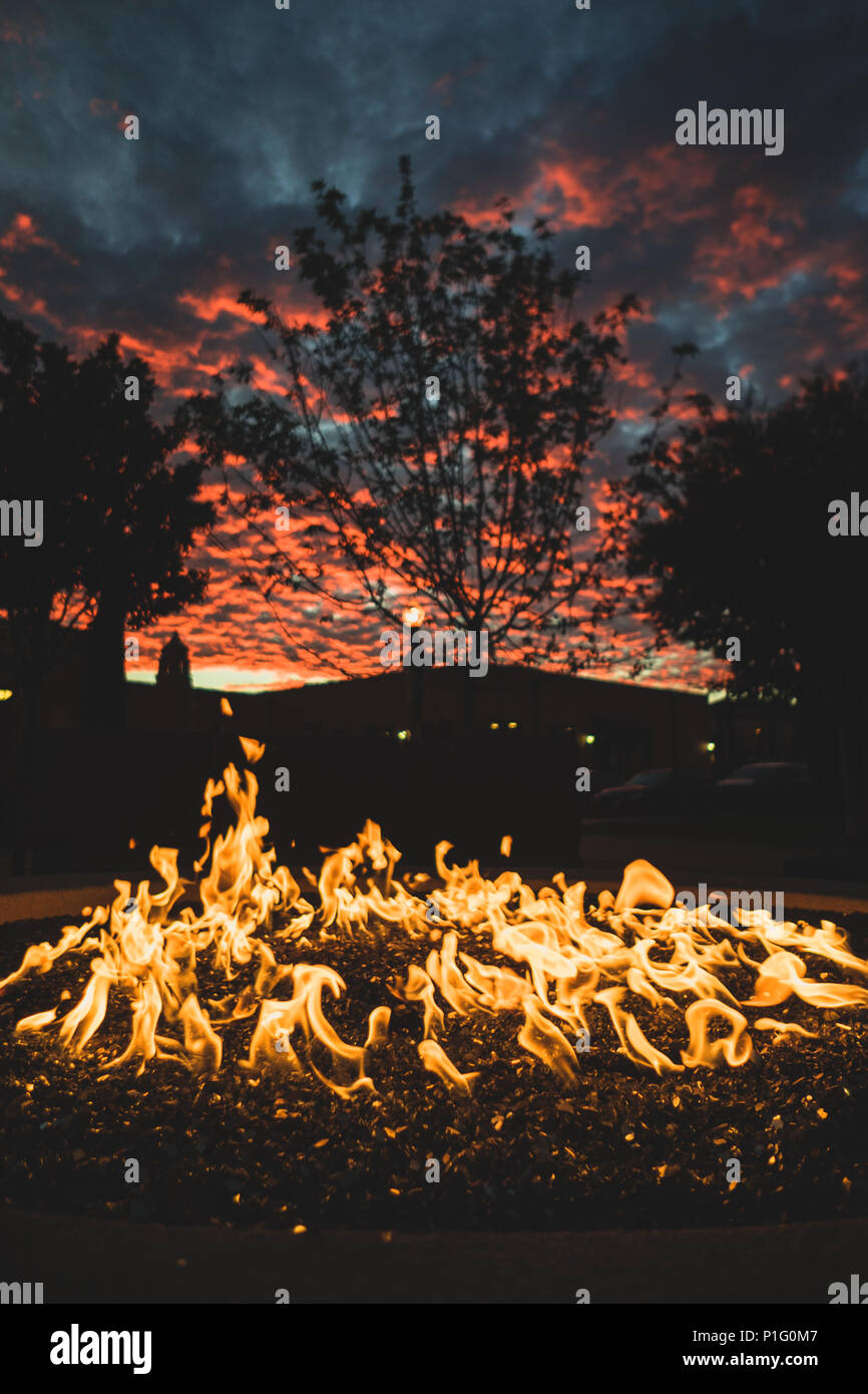 Outdoor fire pit with sunset Stock Photo - Alamy