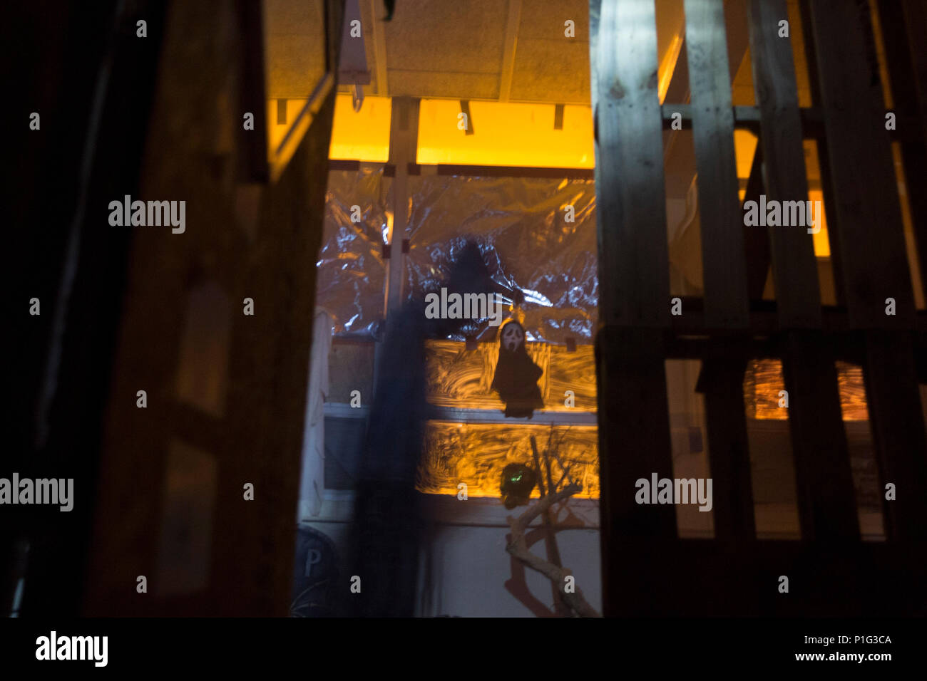 A ghost floats through a graveyard scene in the Okinawa Haunted ...