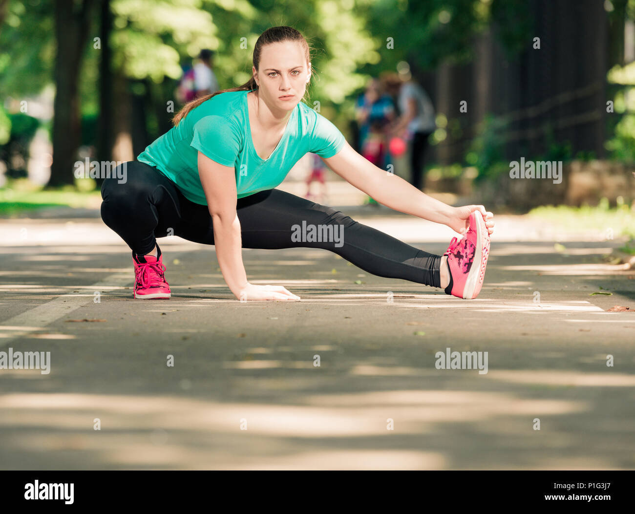 Young girl doing stretching exercise Stock Photo - Alamy