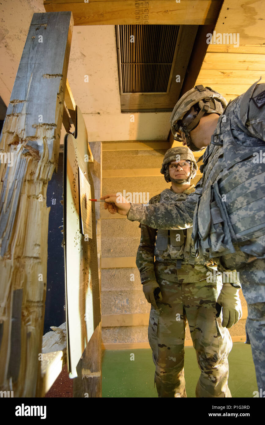 U.S. Army Sgt. 1st Class Scott Null, right, range officer in charge ...