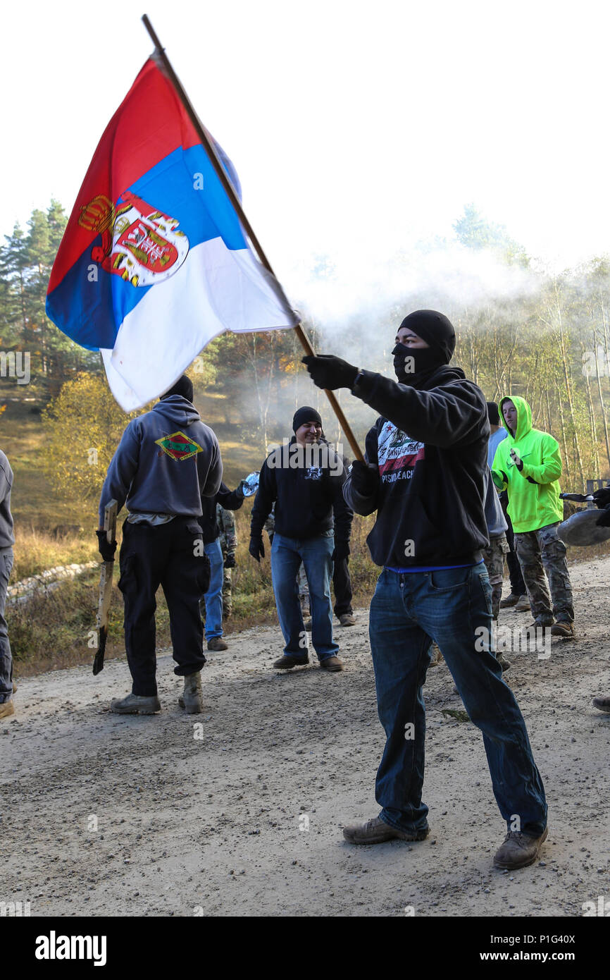 A U.S. Soldier of 1st Battalion, 4th Infantry Regiment waves a Serbian ...