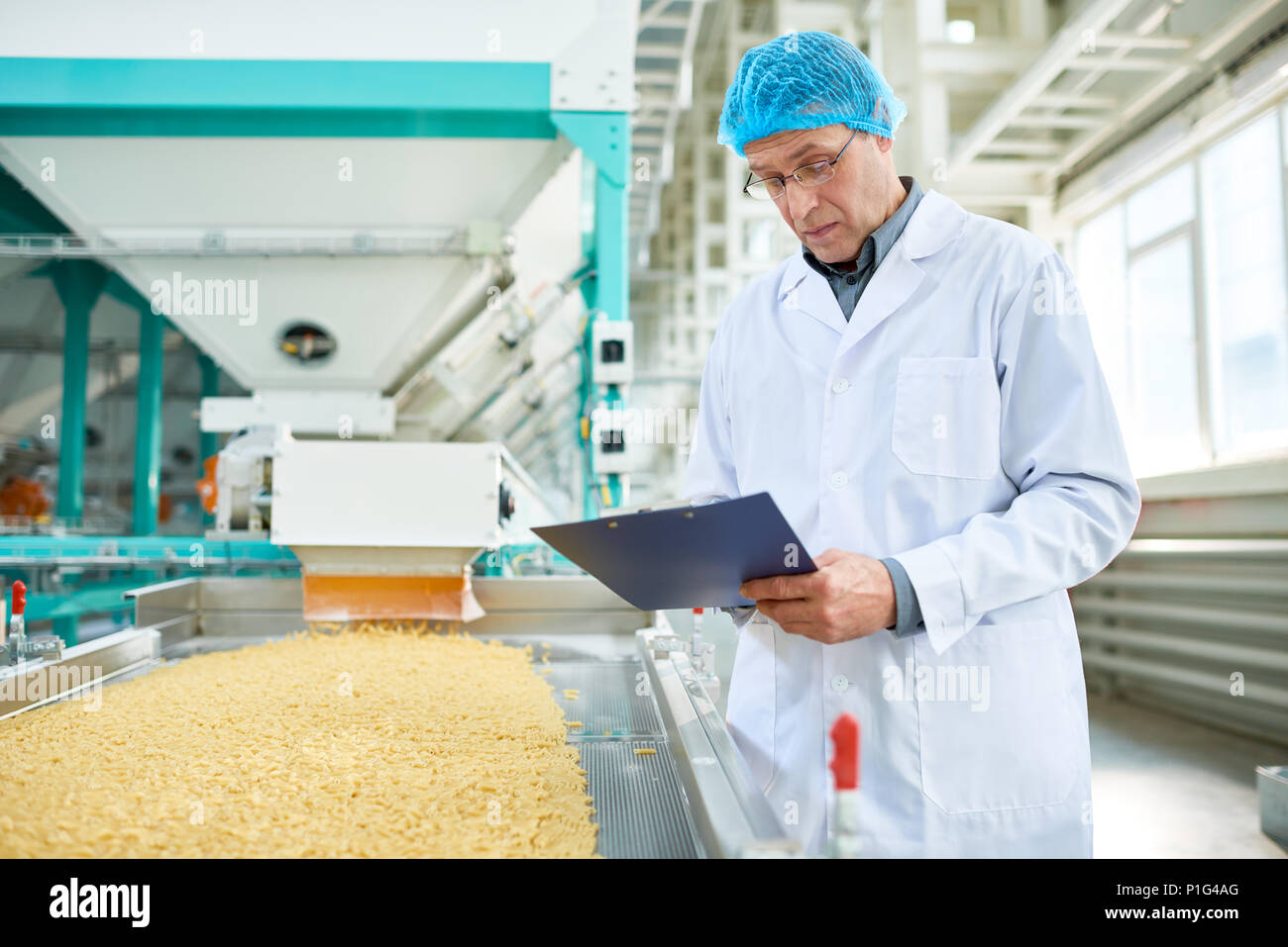Senior Man Working at Food Factory Stock Photo - Alamy