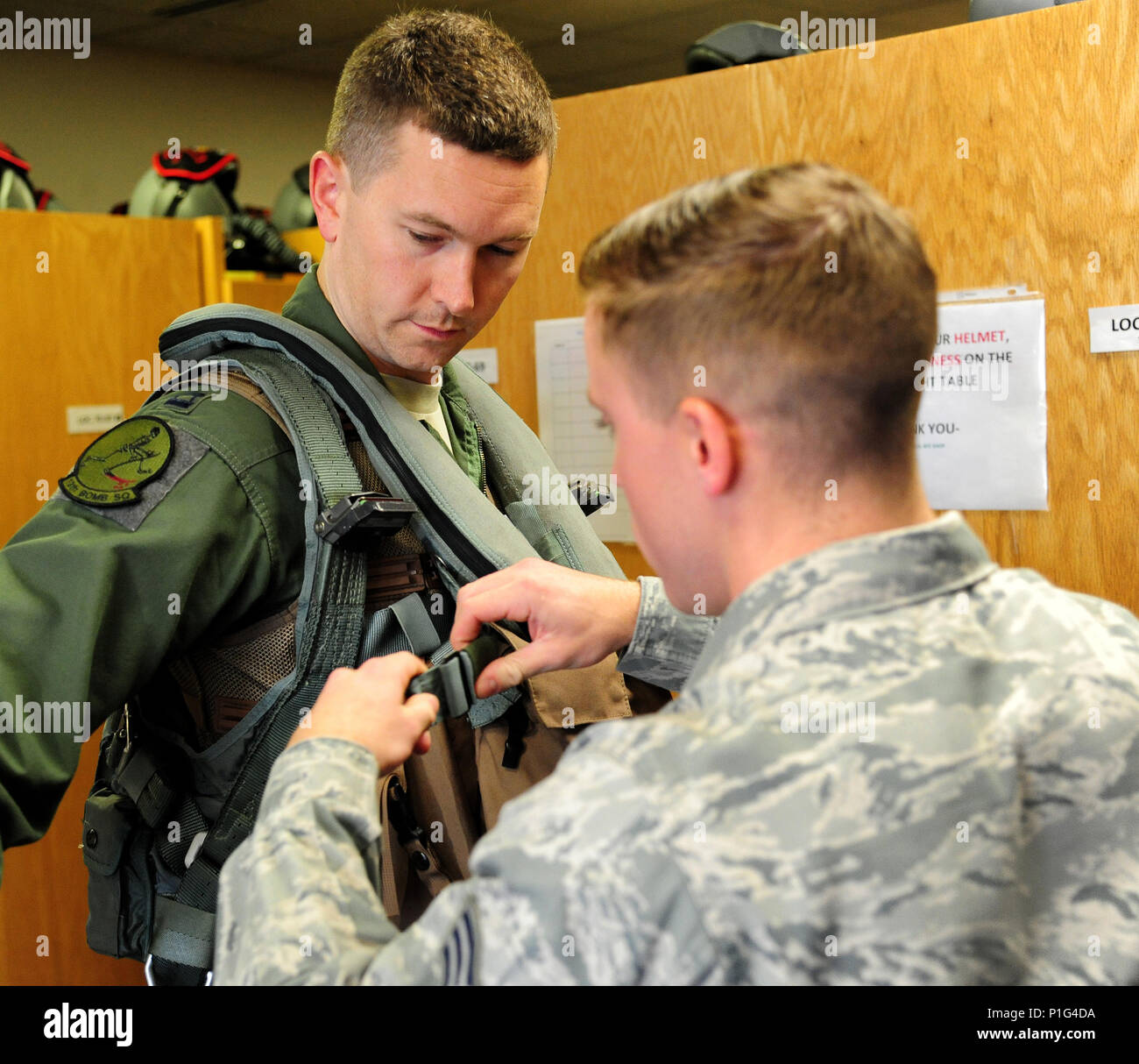 U.S. Air Force Senior Airman Adam Clapp, right, an aircrew flight ...