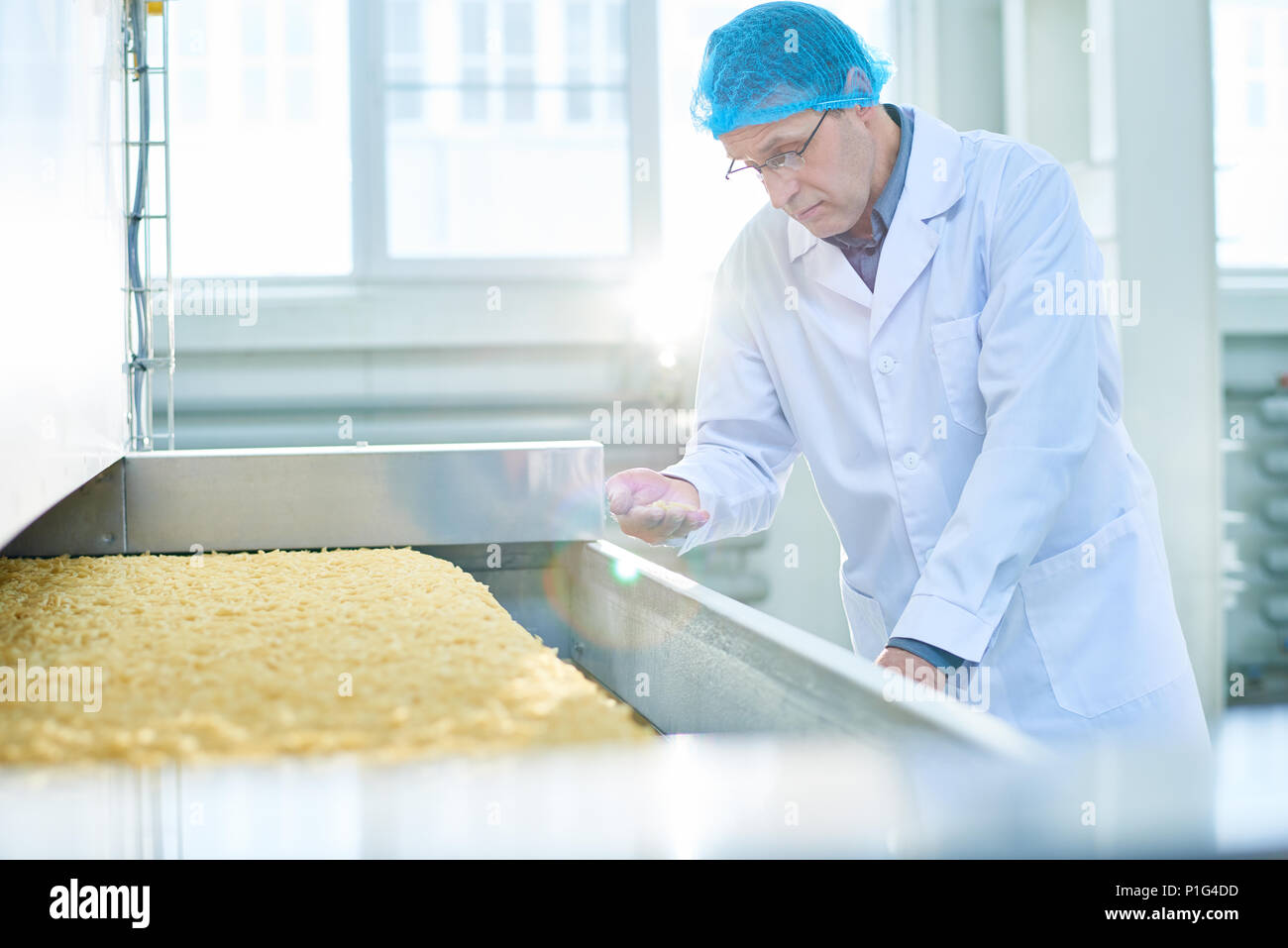 Senior Inspector Checking Quality at Food Factory Stock Photo - Alamy