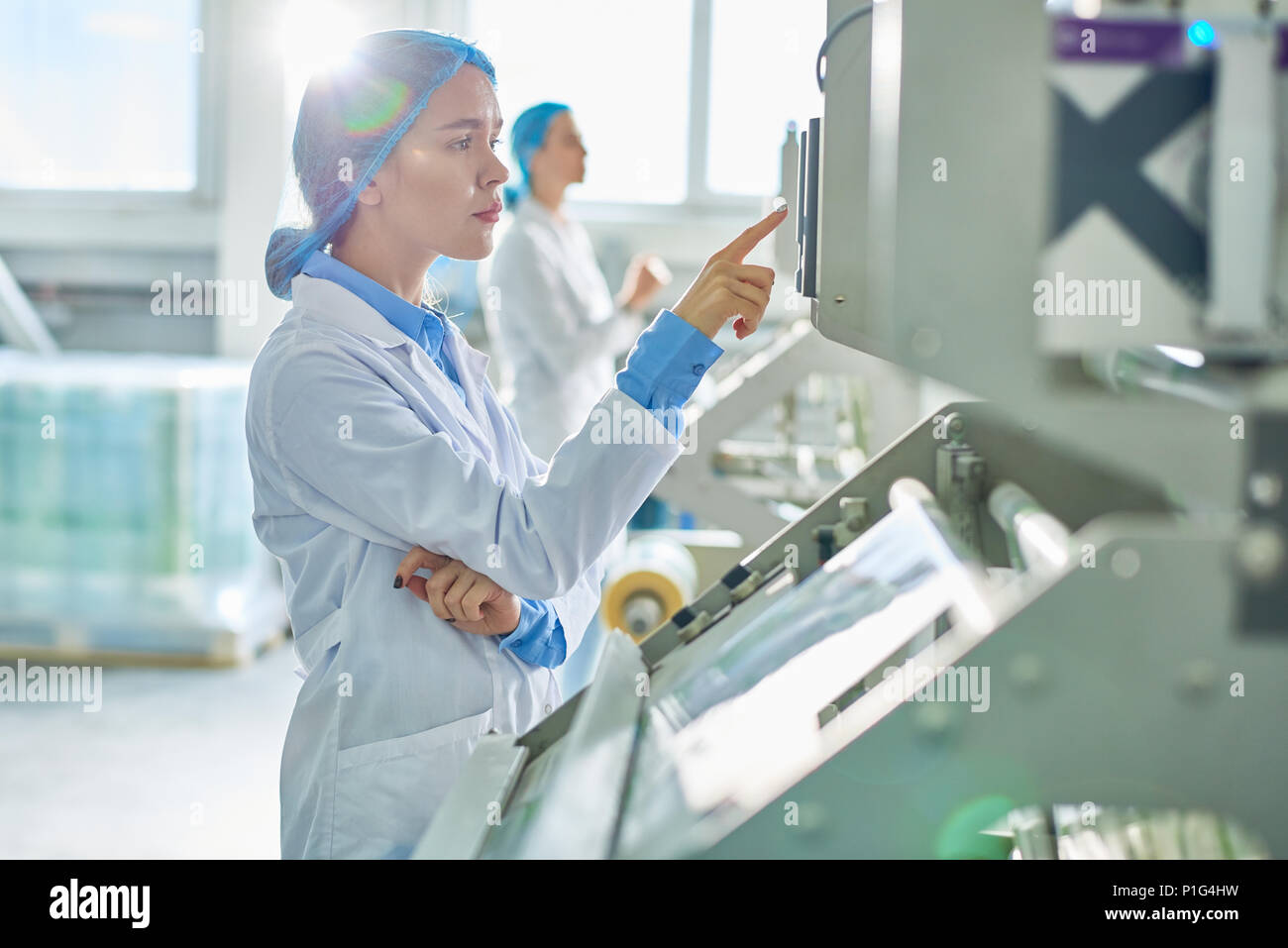 Female Worker at Modern Factory Stock Photo - Alamy