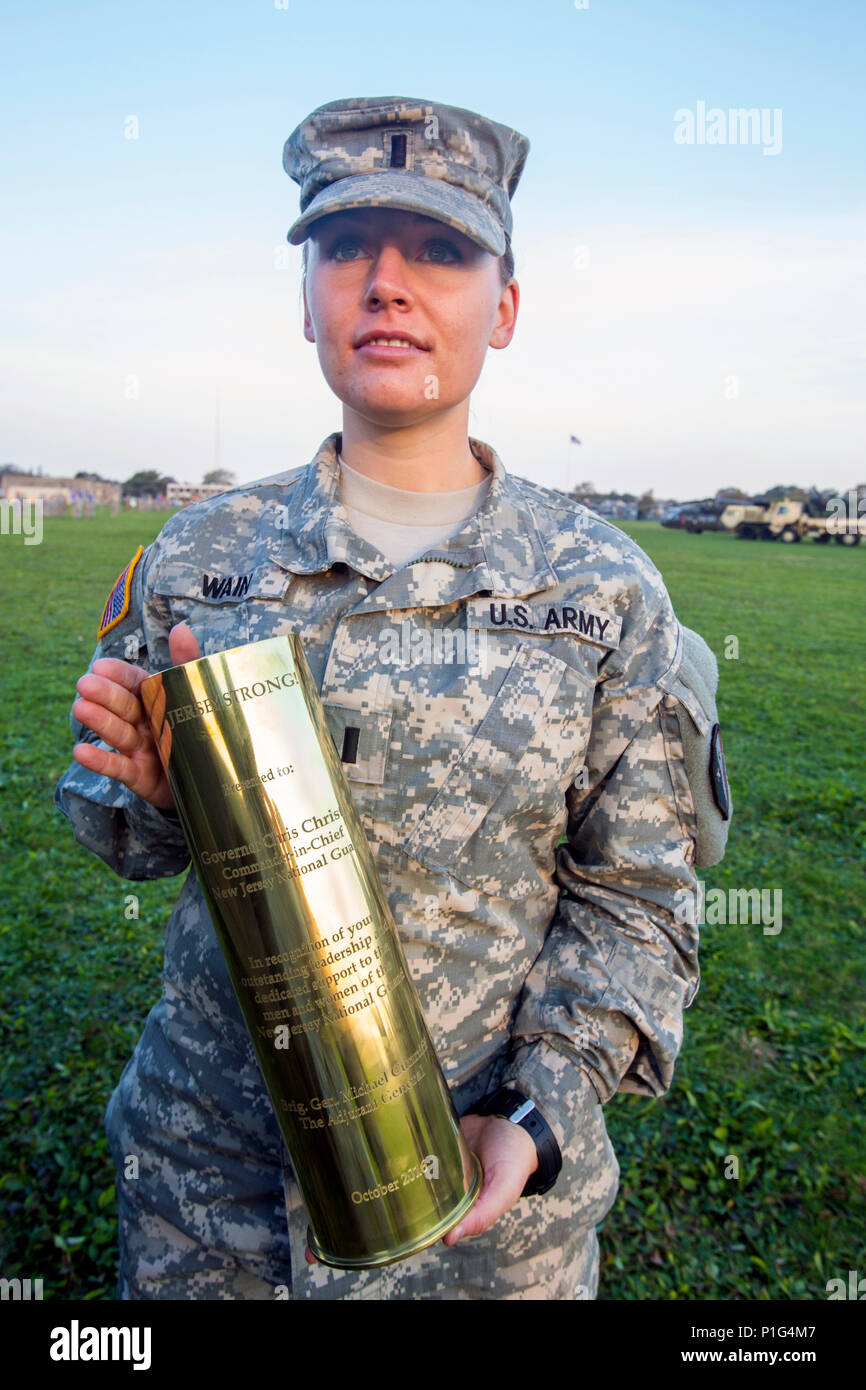 1st Lt. Jennifer Wain, A Battery, 3-112th Field Artillery, holds the ...