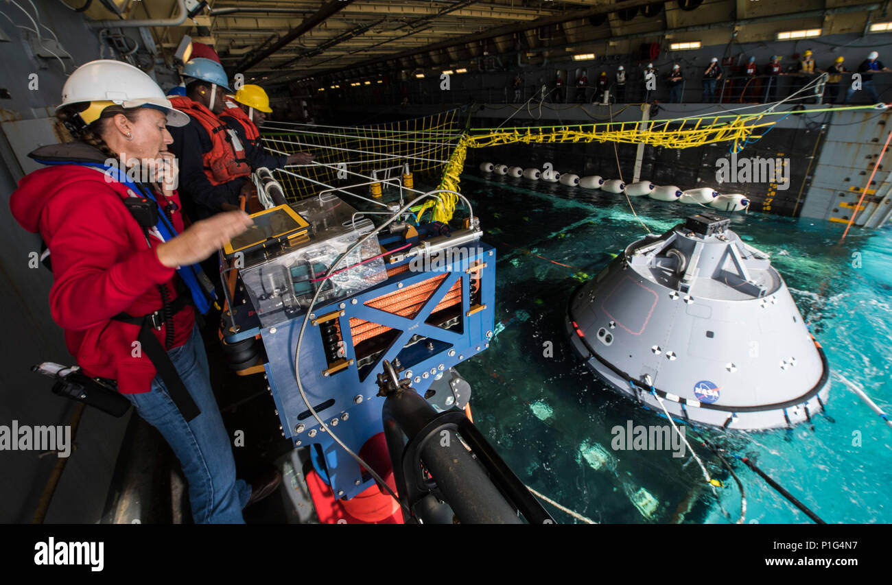 NASA’s Orion program personnel work with Sailors aboard the amphibious ...