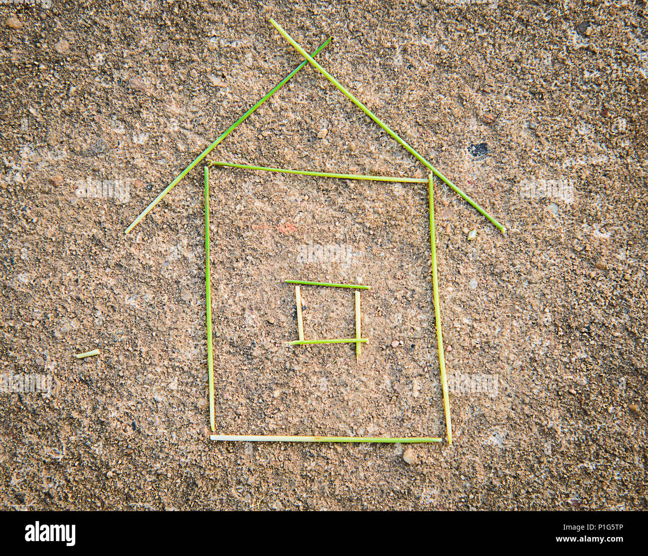 Grass house on the ground, Dream house success concept Stock Photo - Alamy