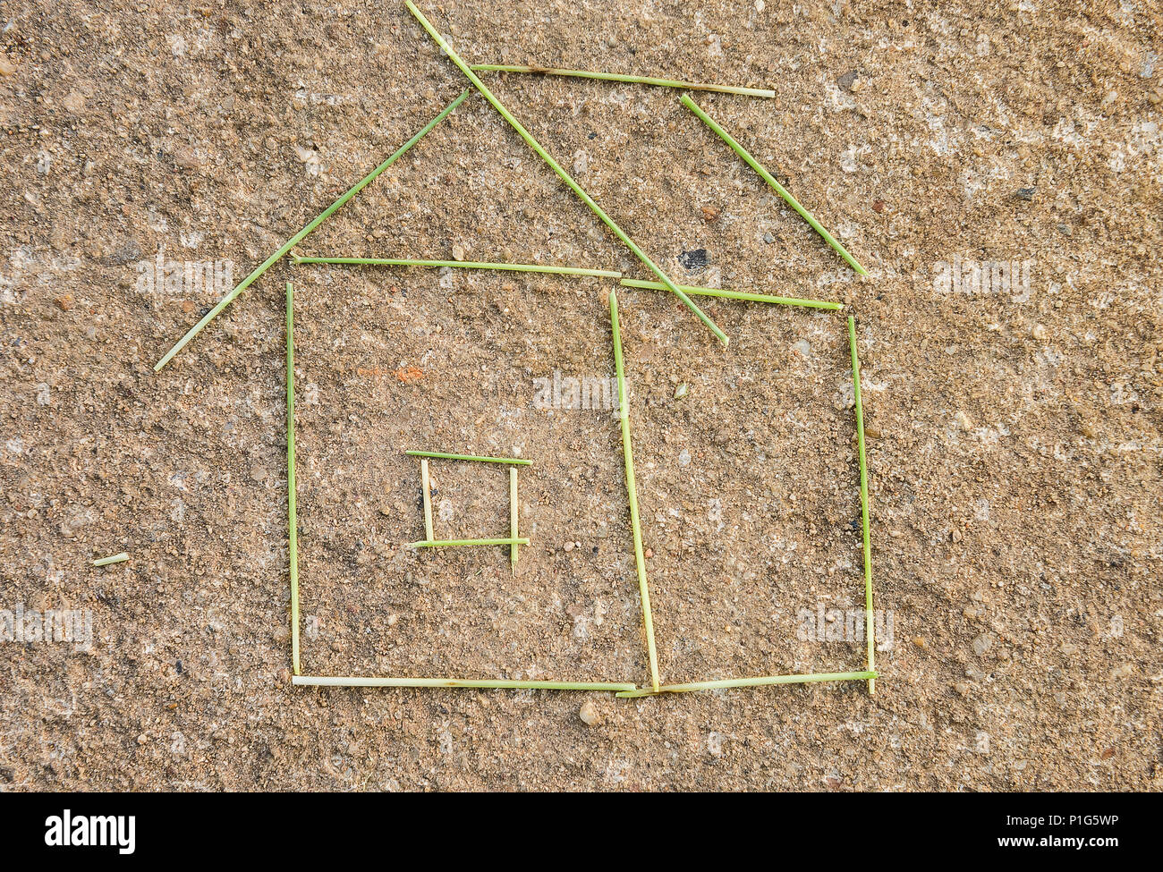Grass house on the ground, Dream house success concept Stock Photo - Alamy