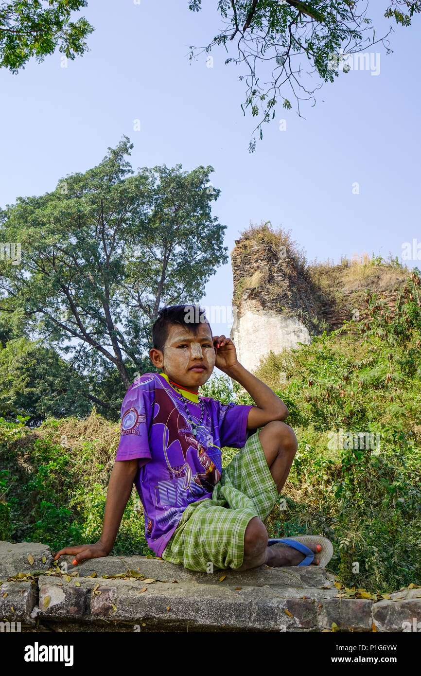 Mandalay, Myanmar - Feb 11, 2017. Portrait of Burmese boy with thanaka ...