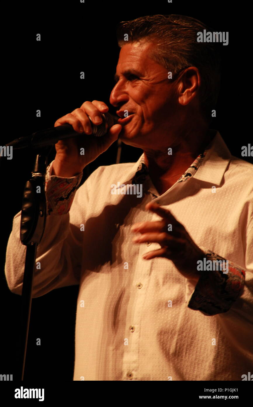 Jerry Rivas, from El Gran Combo perform for the local residents and ...