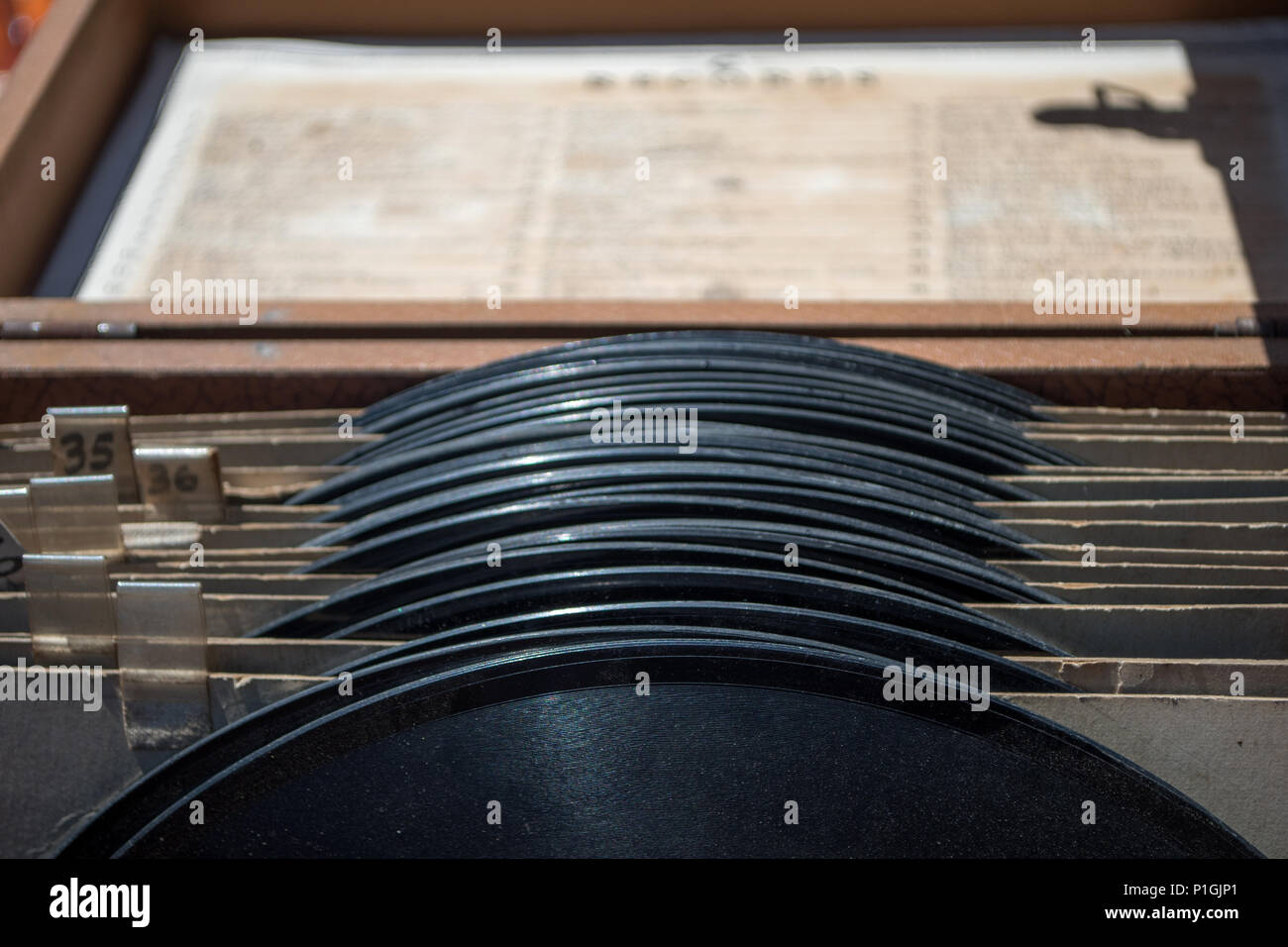 a box of old vintage record discs in a record box. antique music lps ...