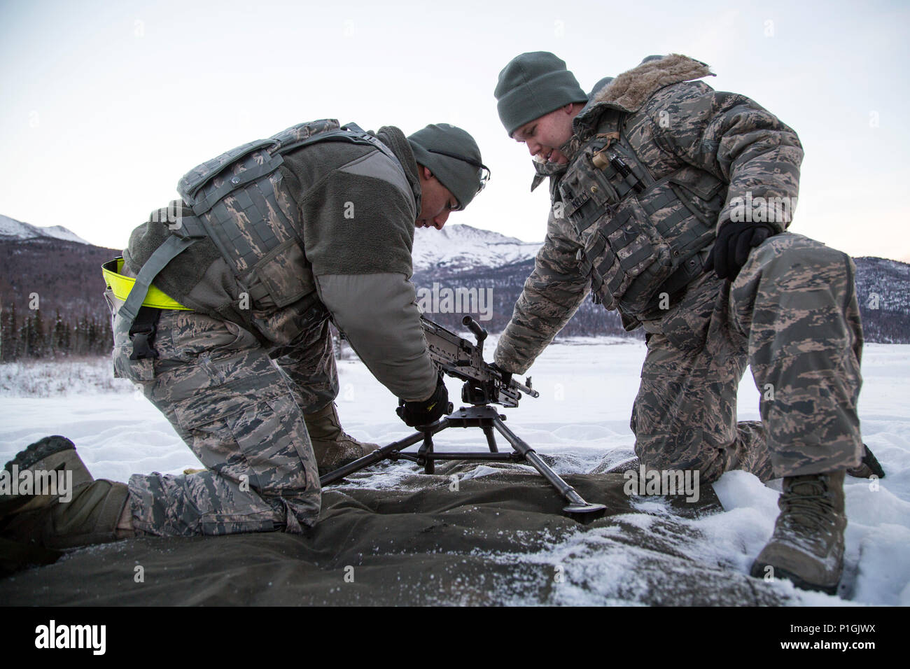 U.S. Air Force Airman 1st Class Isaiah McKee, left, and Senior Airman ...