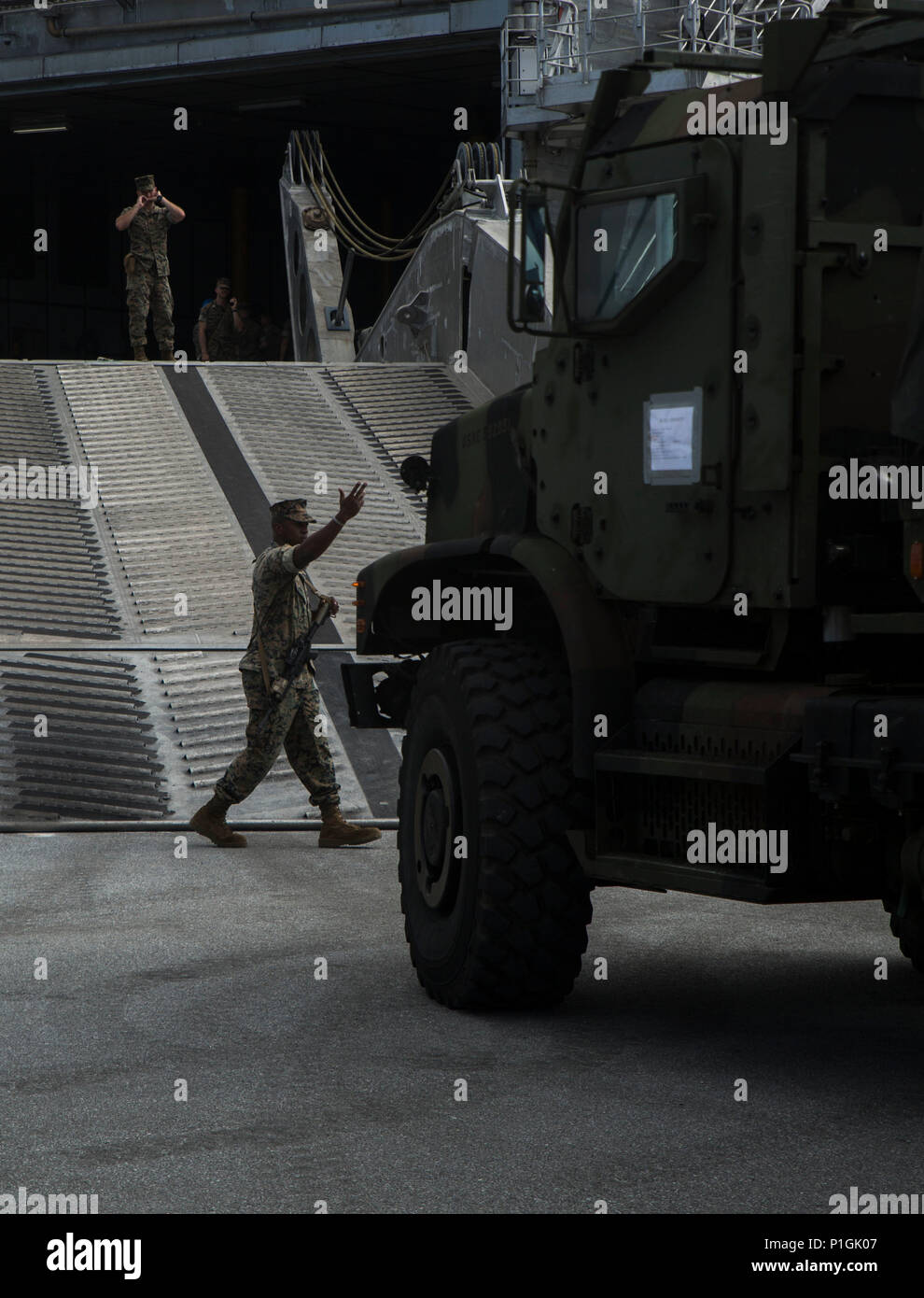 Sgt. Jeremaine Craighead, from Alexandria, Virginia, guides a 7-ton ...