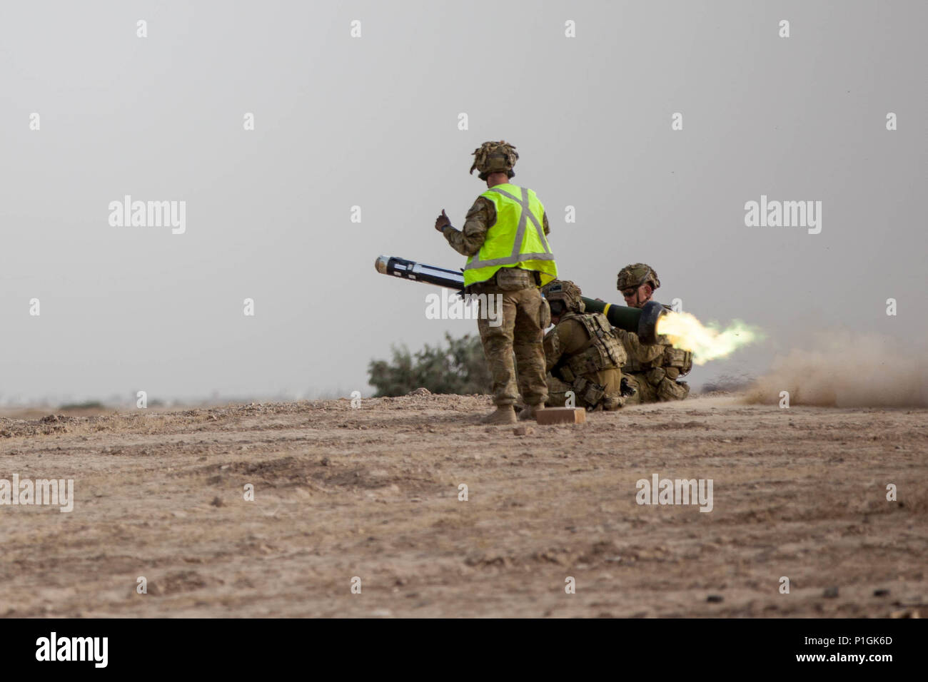 Australian soldiers from Training Task Unit, Task Group Taji 3 fire a ...