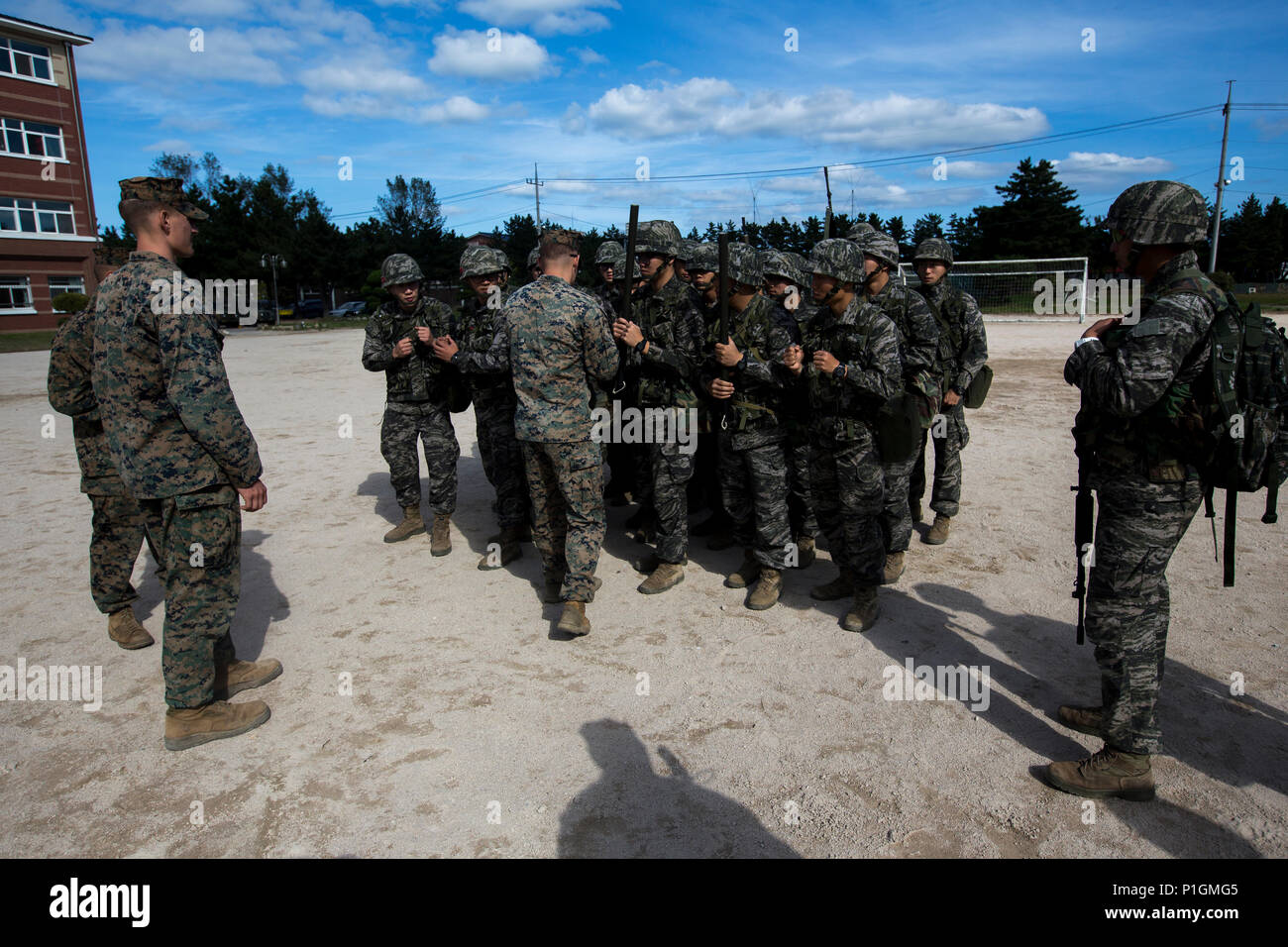 U.S. Marines with Lima Company, 3rd Battalion 2nd Marines, instruct ...