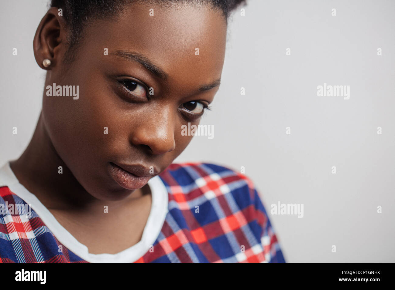 close up cropped photo of black girl with distrustful expression Stock ...