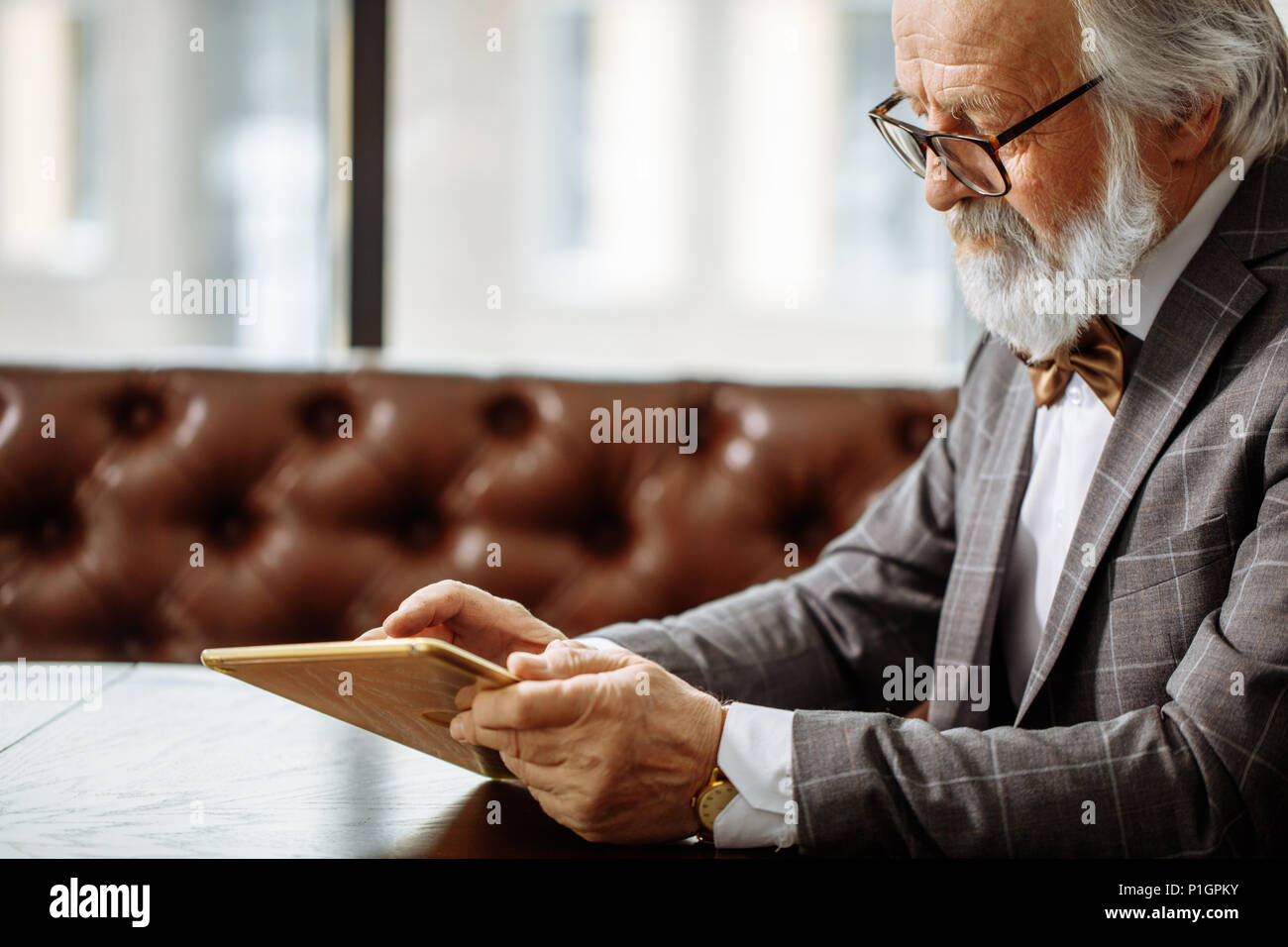 old lecture preparing for the seminar with the help of tablet Stock ...
