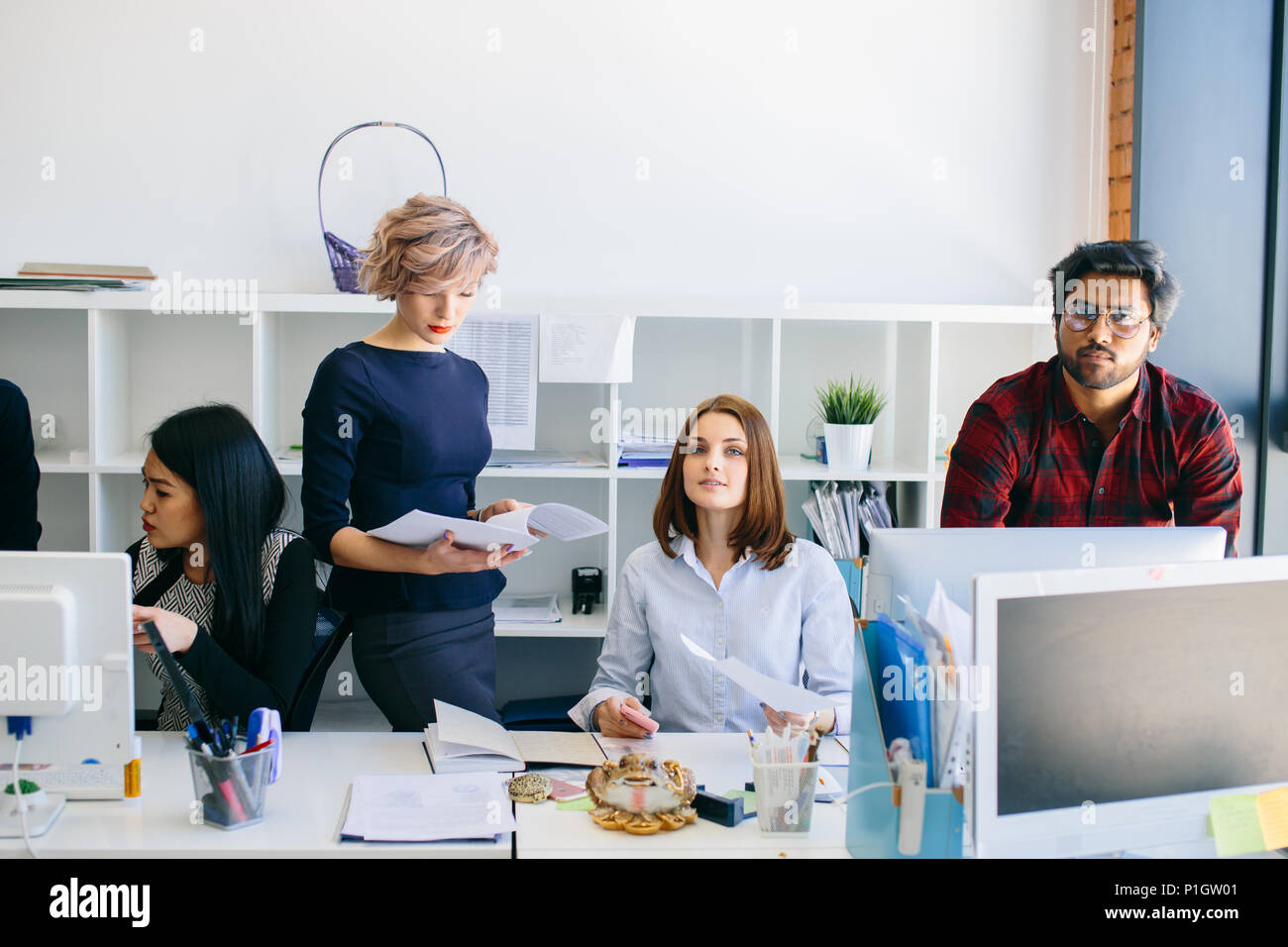 working people in a small company Stock Photo - Alamy