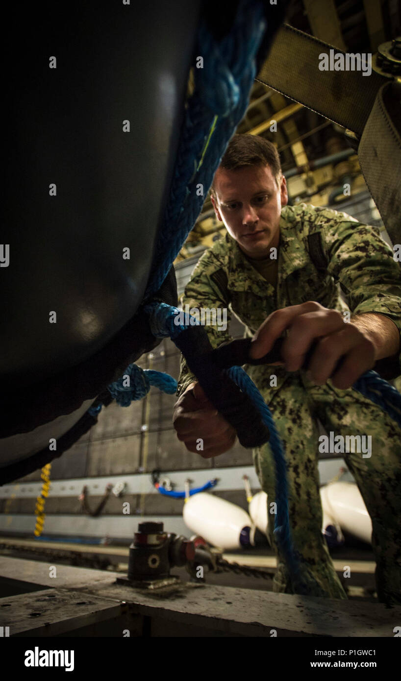 Petty Officer 2nd Class Ryan Mead, a Navy diver assigned to Explosive ...