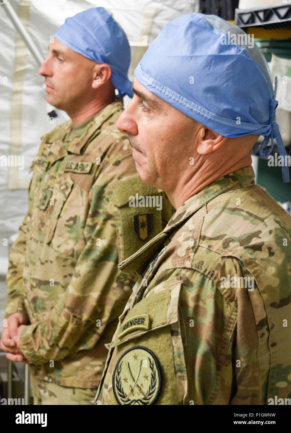 U.S. Army Sgt. 1st Class Joel Haarstad, left, wardmaster, 28th Combat ...