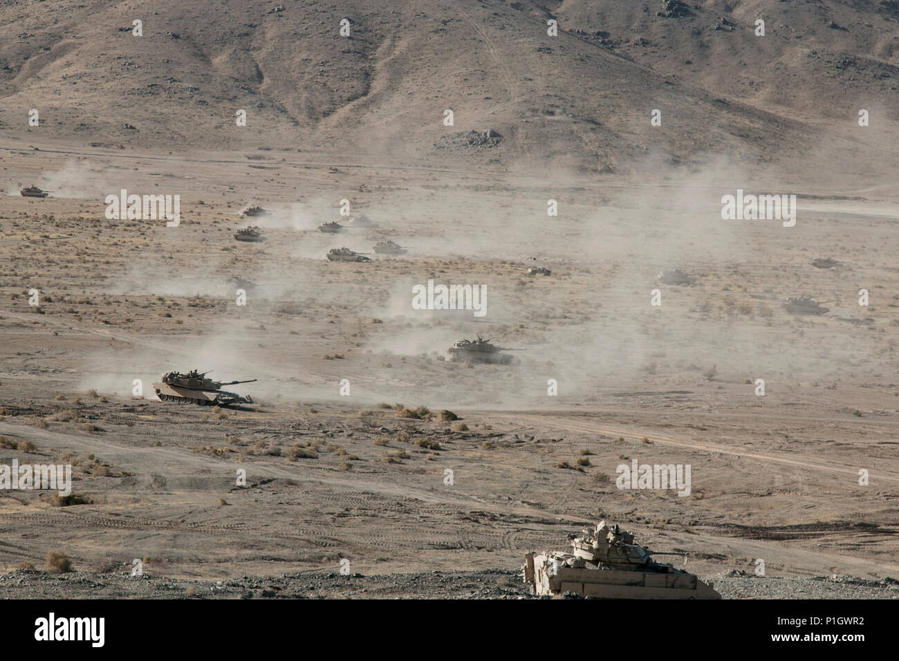 A barrage of U.S. Army M1A2 Abrams tanks from the 3rd Battalion, 8th ...