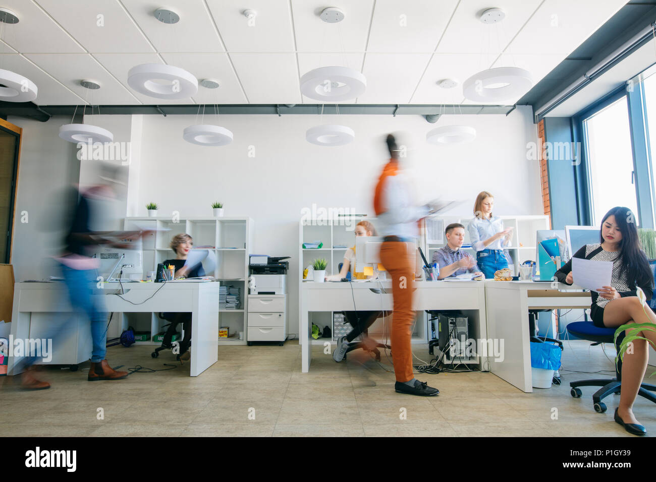 silhouettes of active workers at workplace Stock Photo - Alamy