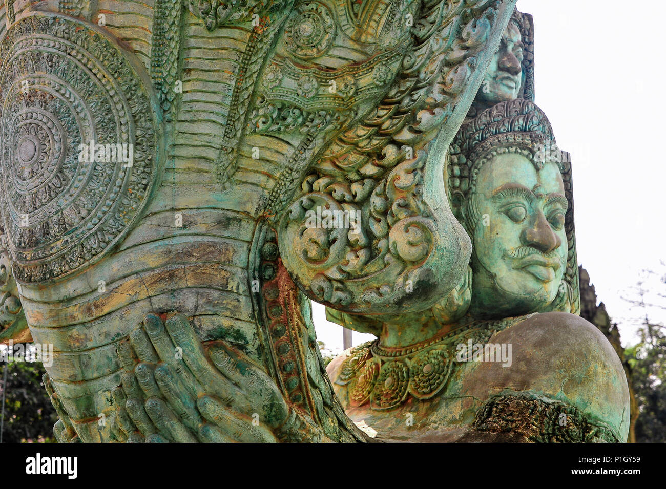 Warrior statue holding the head of Naga, a giant serpent, guards the ...