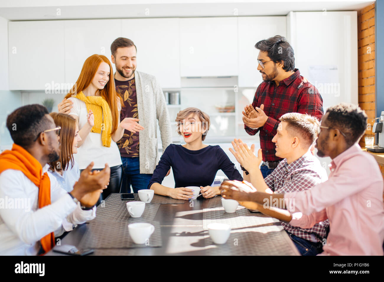 employees enjoying spending time togeter while drinking coffee Stock ...