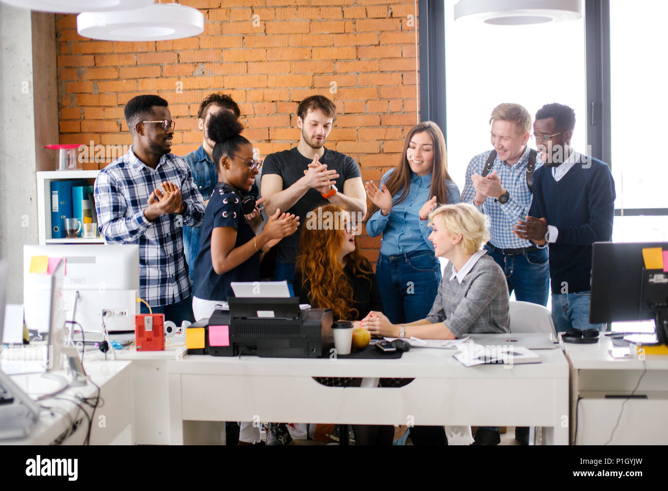 office workers are warmly greeting and welcoming new partner Stock ...