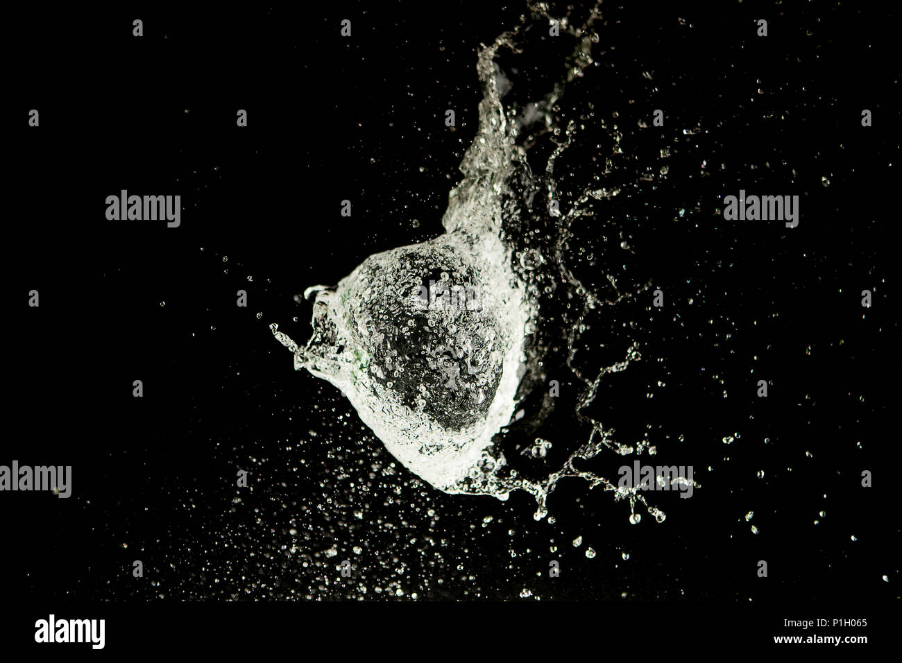 high-speed photograph of a balloon filled with exploding water Stock ...