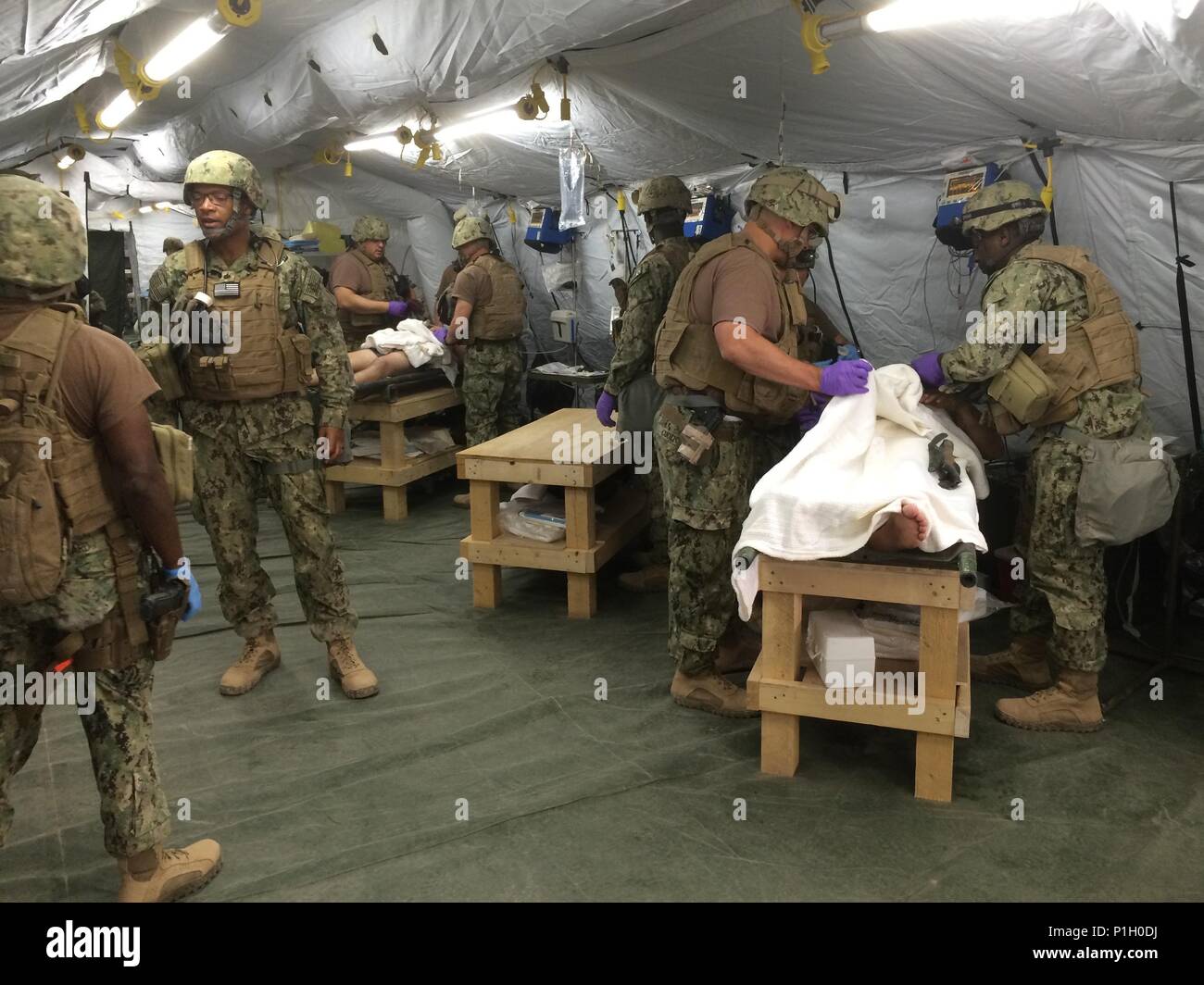 U.S. Navy Sailors, Expeditionary Medical Unit – Gulf, treat simulated ...