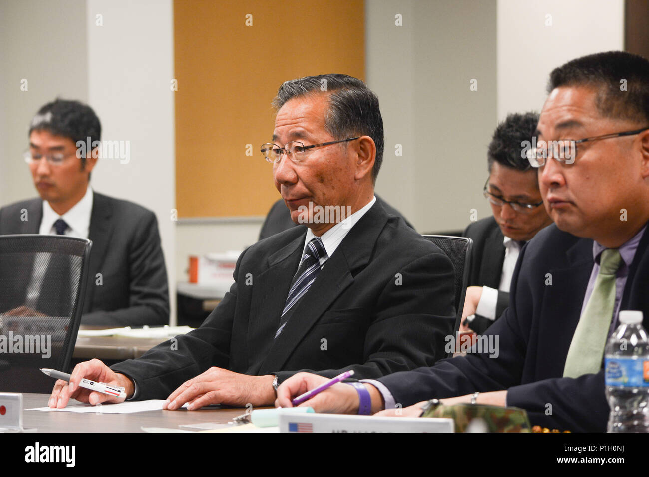 Lt. Gen. (Ret.) Mimoto Akiyo of IHI Aerospace Co. Ltd., (center) leads ...