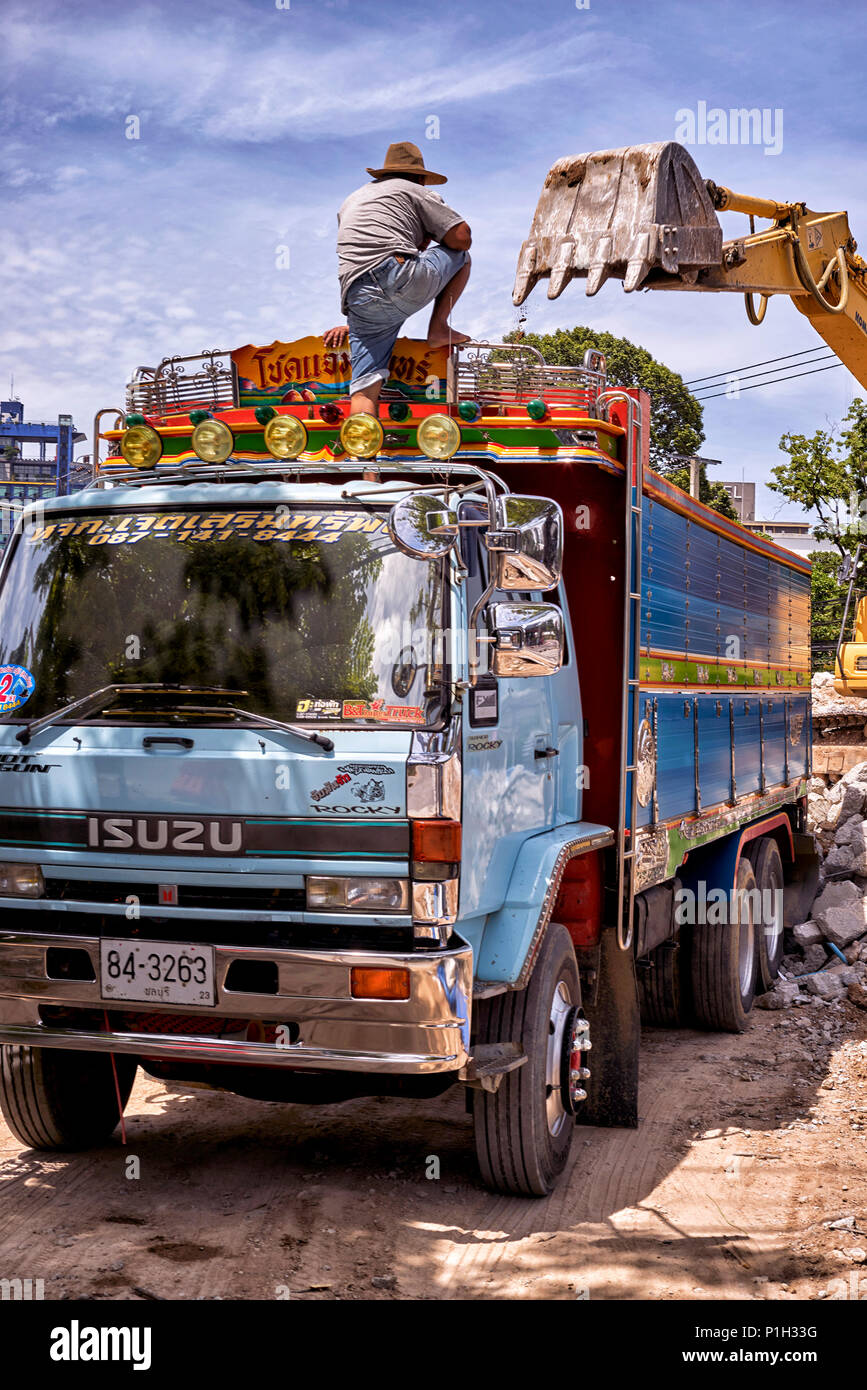 Backhoe digger loading vehicle on a Thailand building site Stock Photo ...