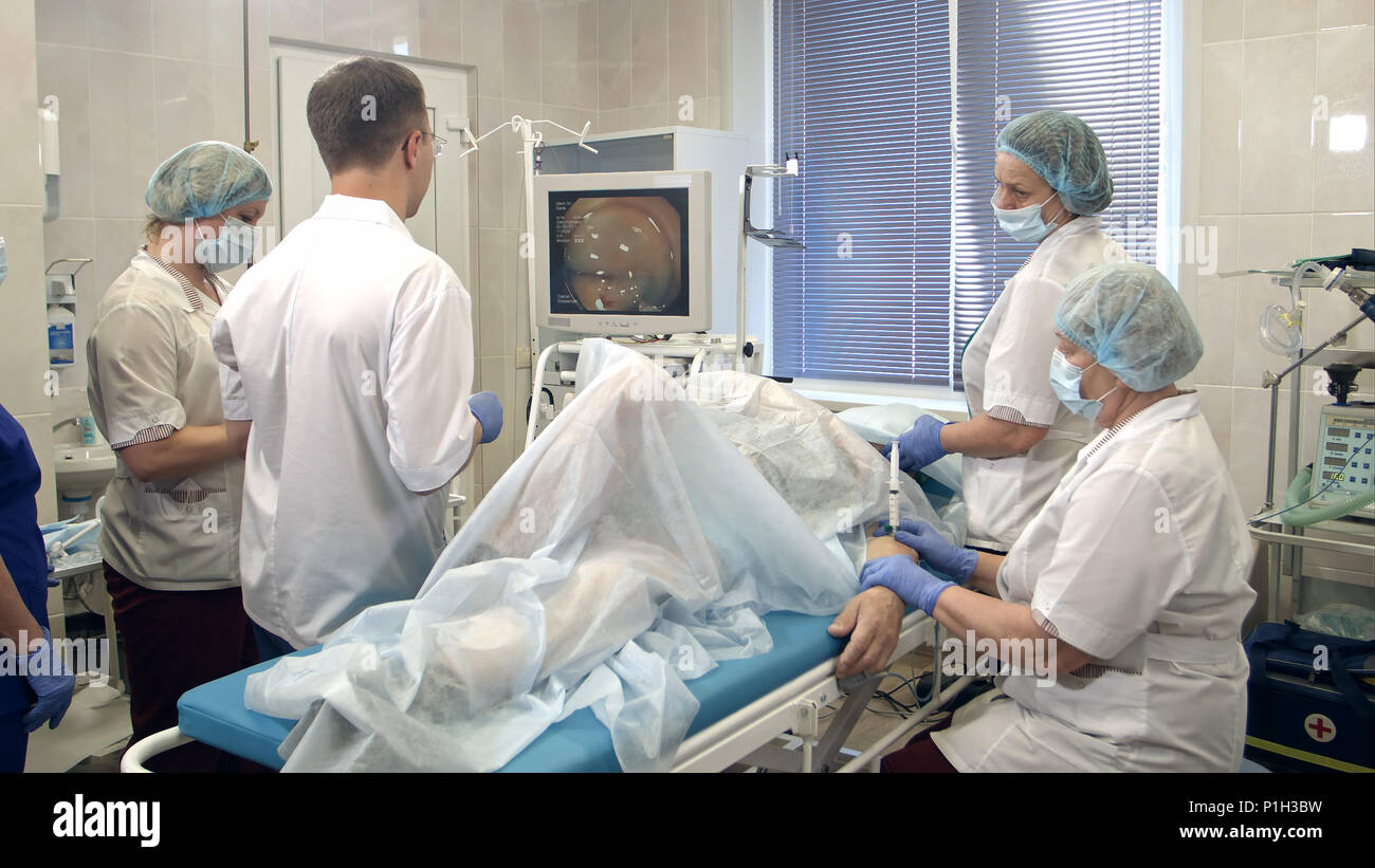 Medical team performing gastro-endoscopy to patient in hospital Stock ...