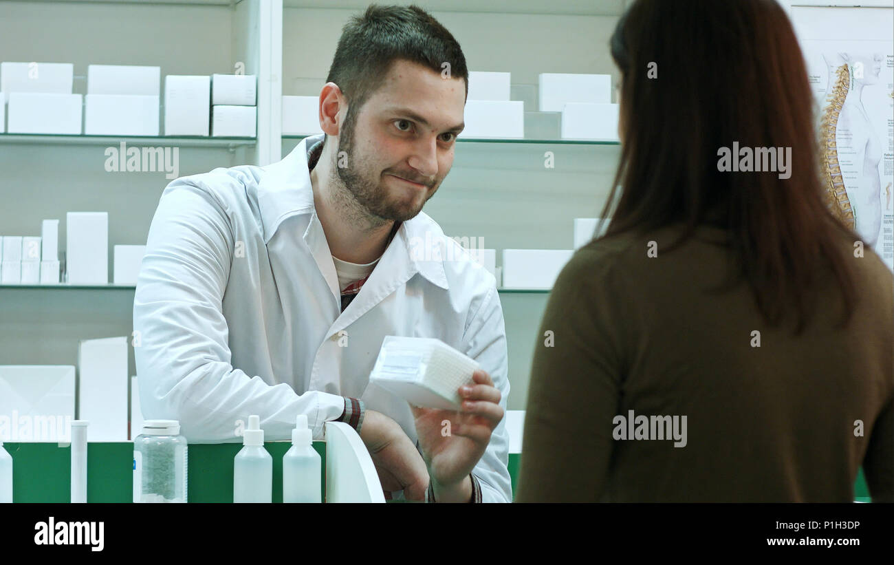 Young female cient come to pharmacy to return tablets Stock Photo - Alamy