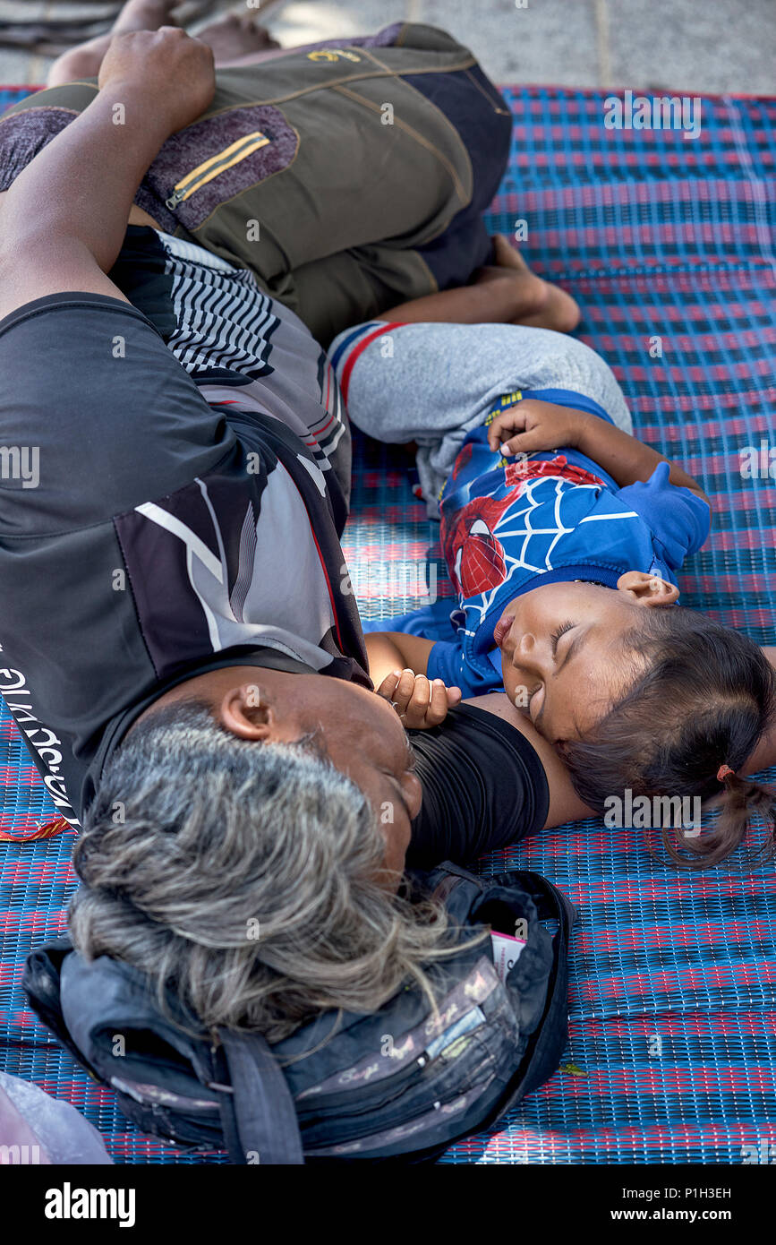 Father and child sleeping on a Thailand street Stock Photo - Alamy