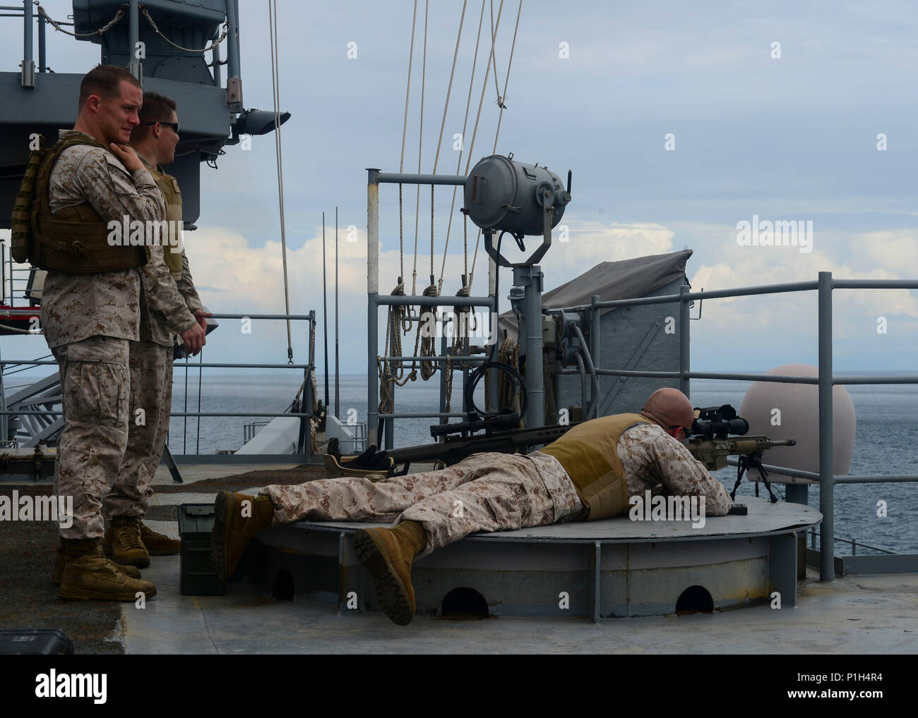 161027-N-TI017-015 GULF OF OMAN (Oct. 27, 2016) A Marine looks through ...