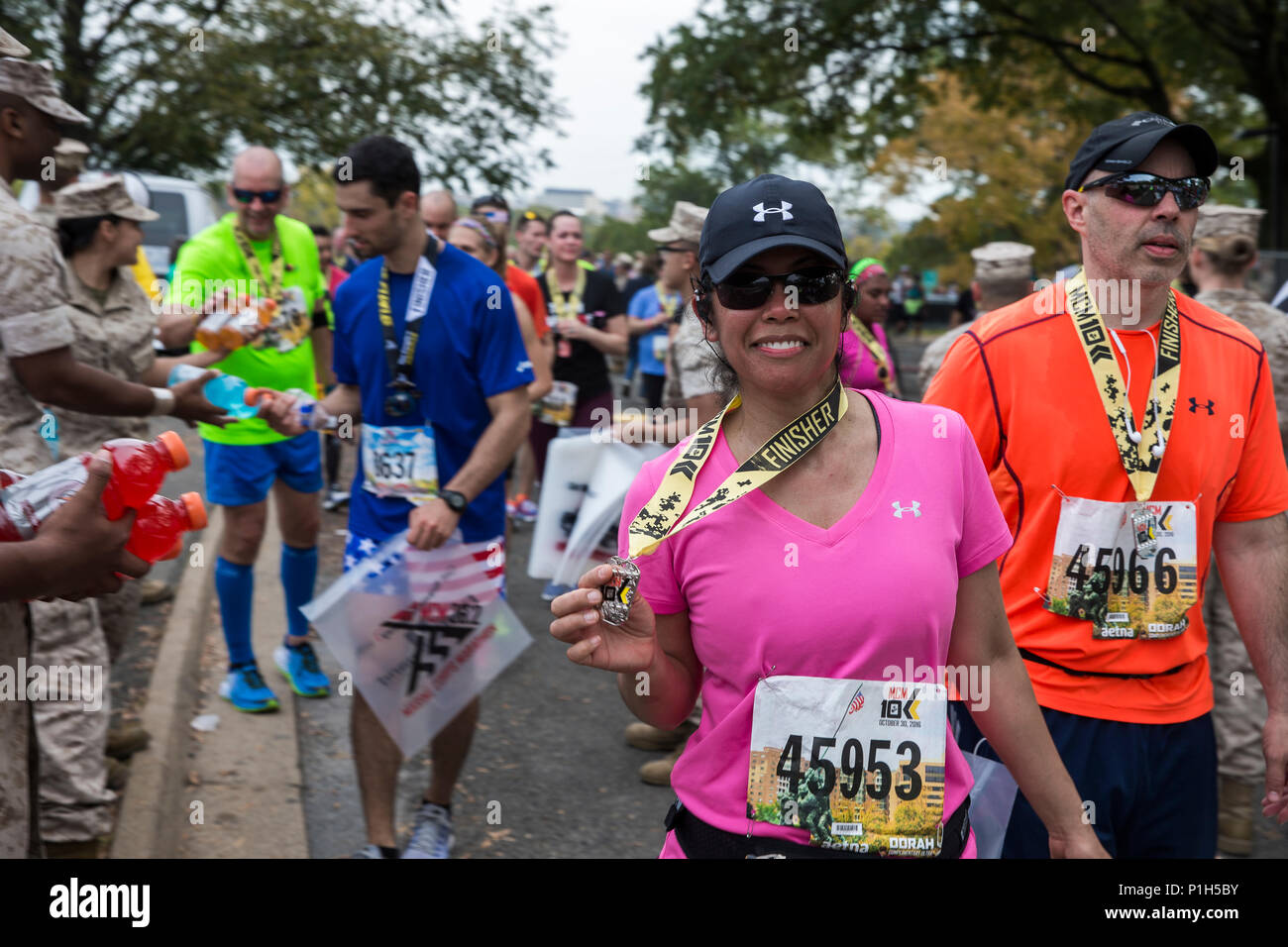 Mirasol Espanola shows off the medal she received for finishing the ...