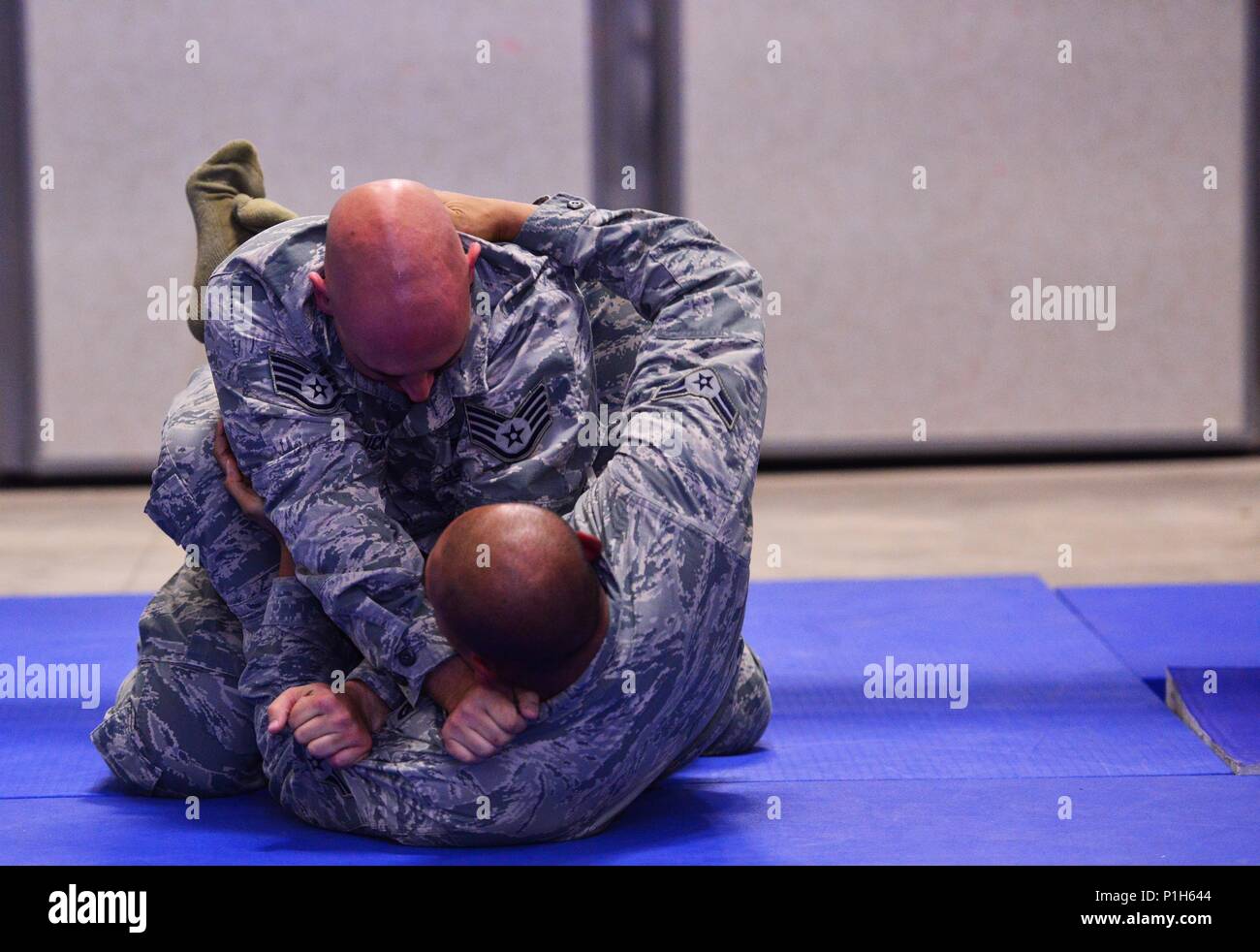 SCHRIEVER AIR FORCE BASE, Colo.--Staff Sgt. Nicholas Burdick restrains ...