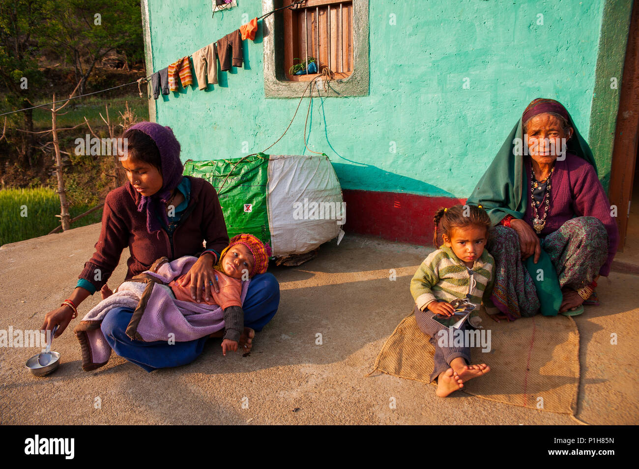 Indian family by house hi-res stock photography and images - Alamy