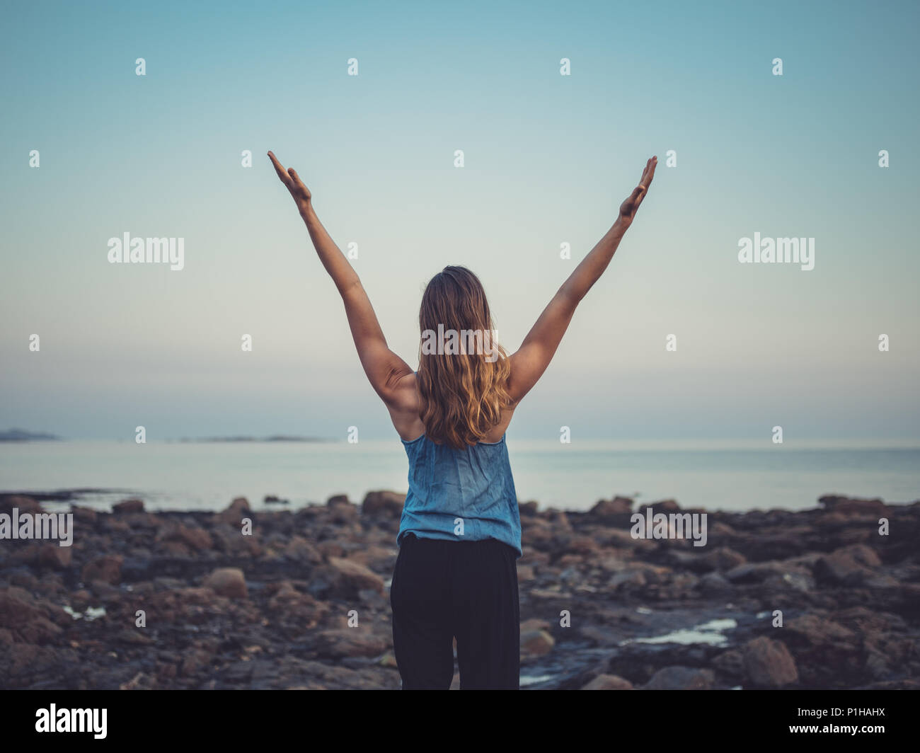 Sun arms raising beach hi-res stock photography and images - Alamy