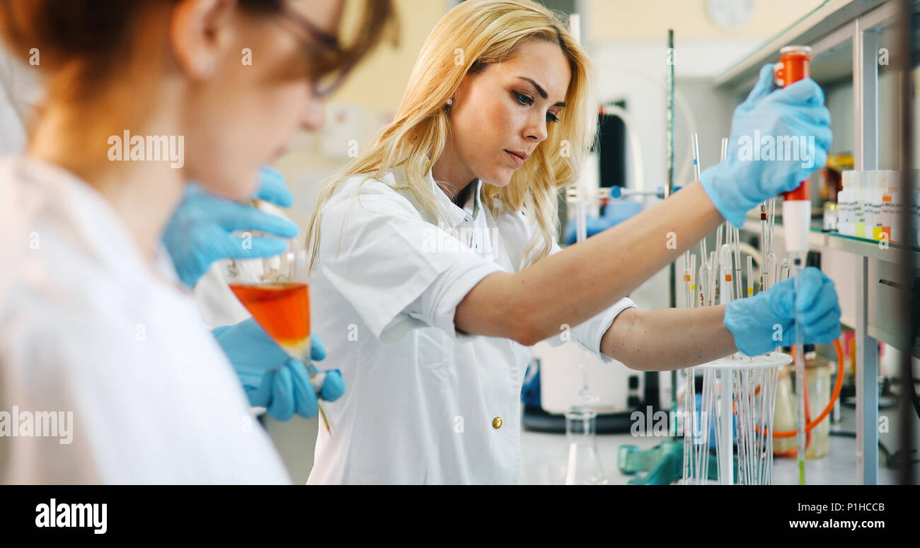 Young students of chemistry working in laboratory Stock Photo - Alamy