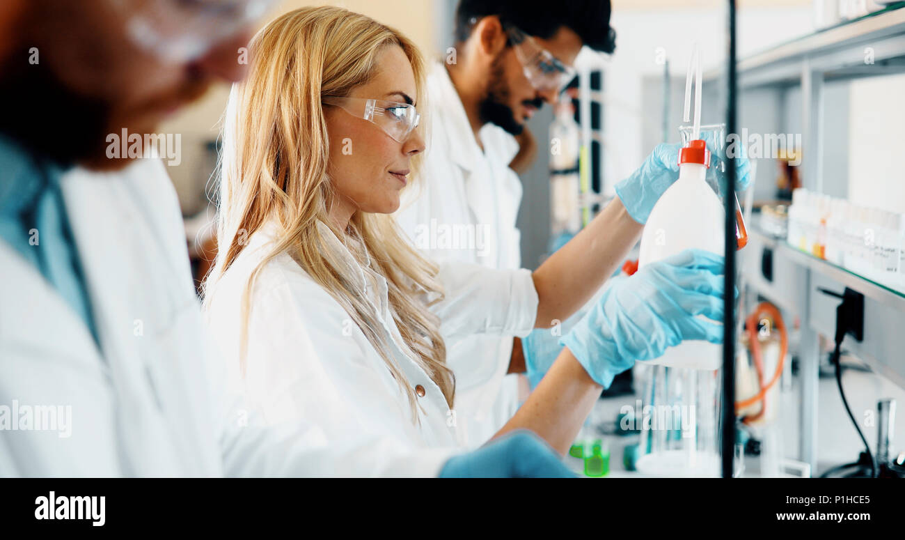 Young students of chemistry working in laboratory Stock Photo - Alamy