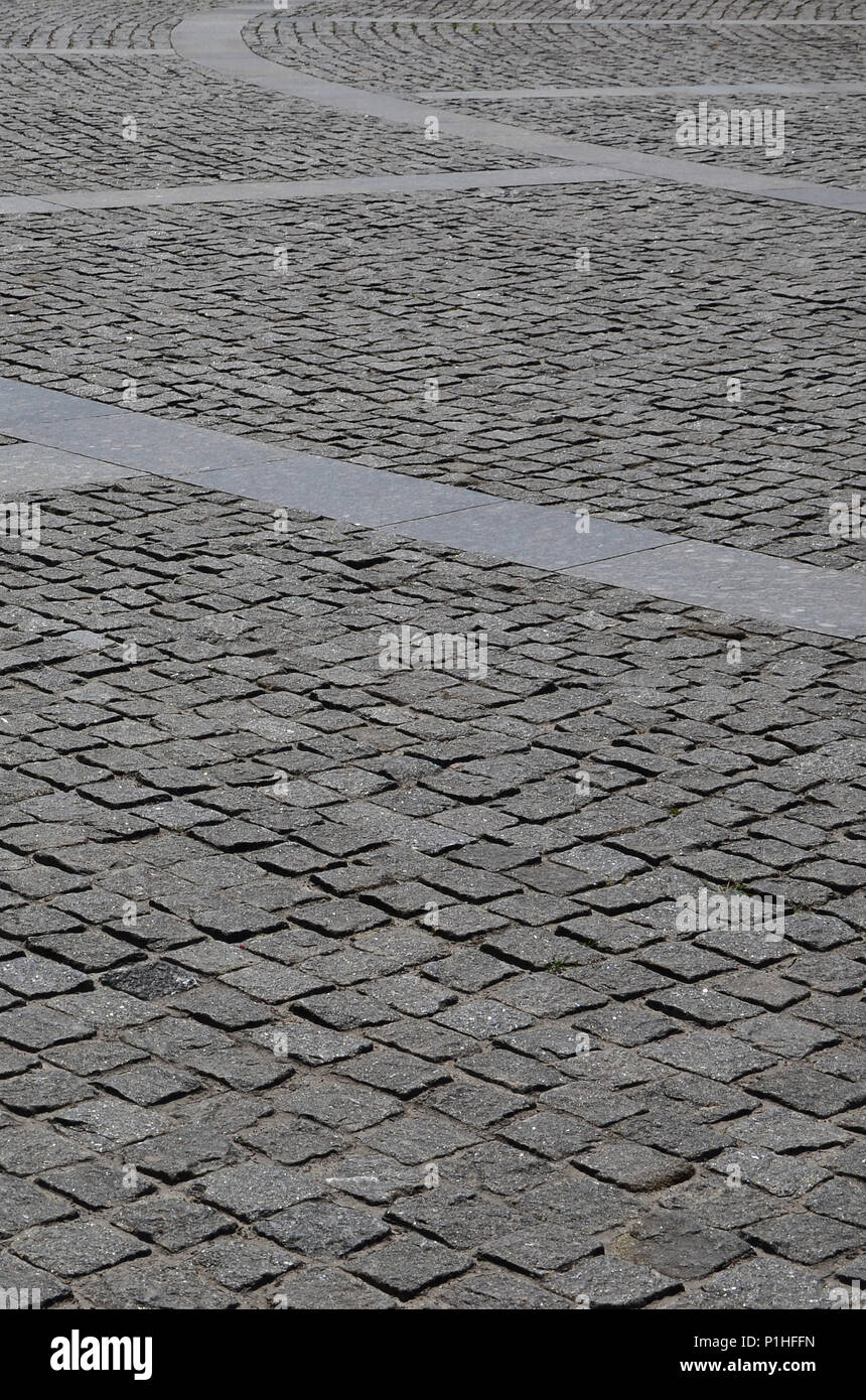 The texture of the paving slab (paving stones) of many small stones of ...